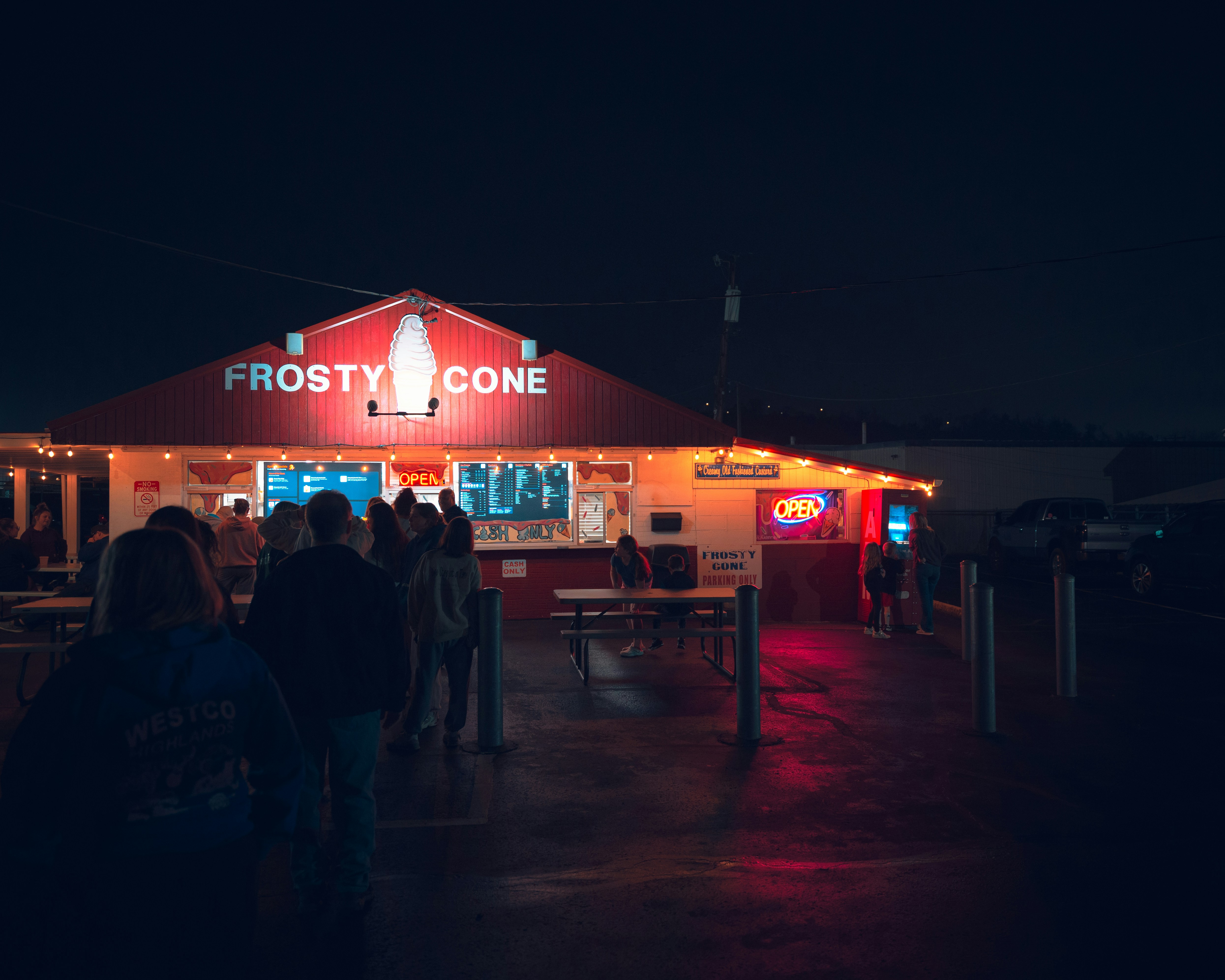 Frosty Cone Night Crowd at a Neon-lit Stand