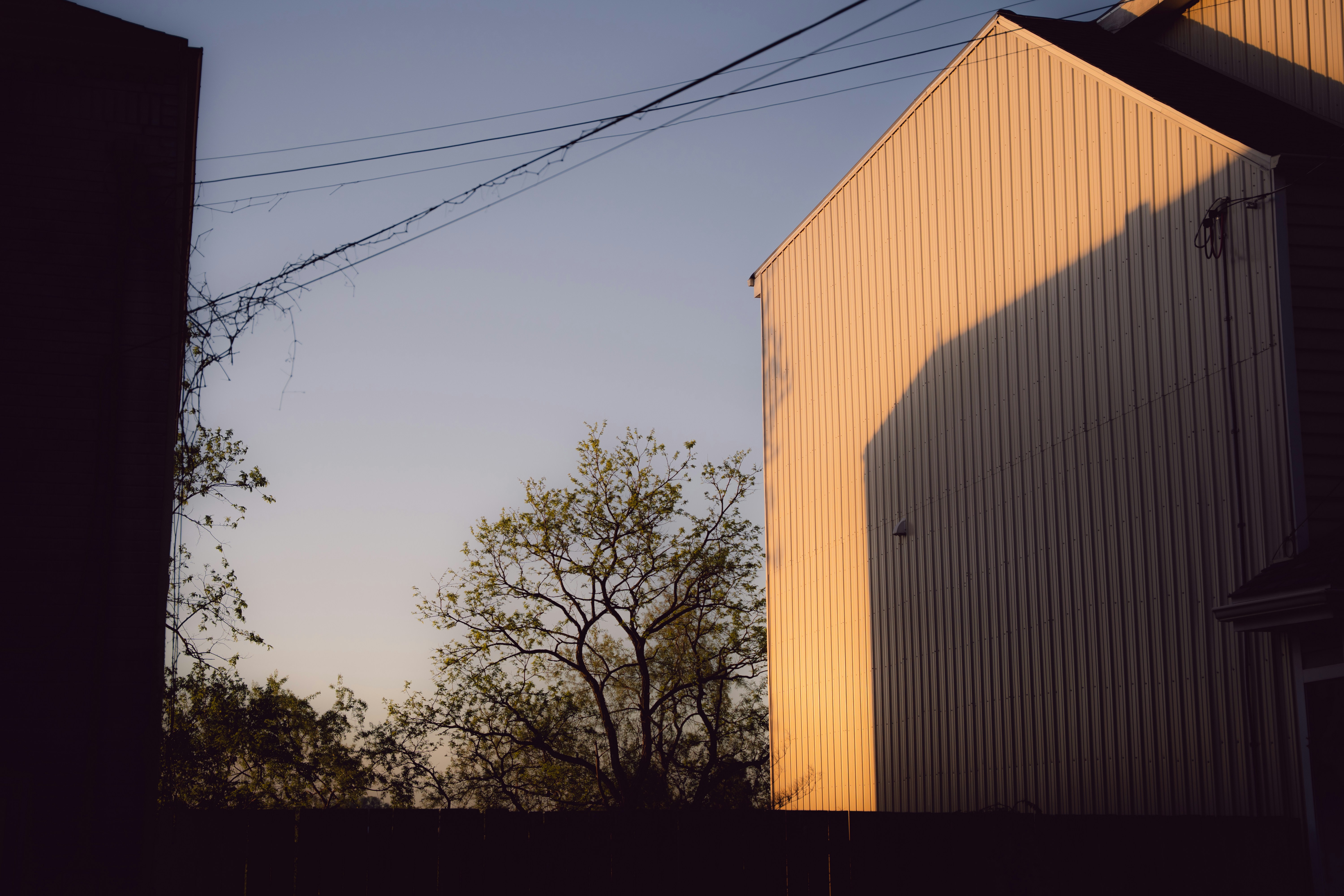 Sunlit Siloed Facade: A Quiet Corner of Evening Light