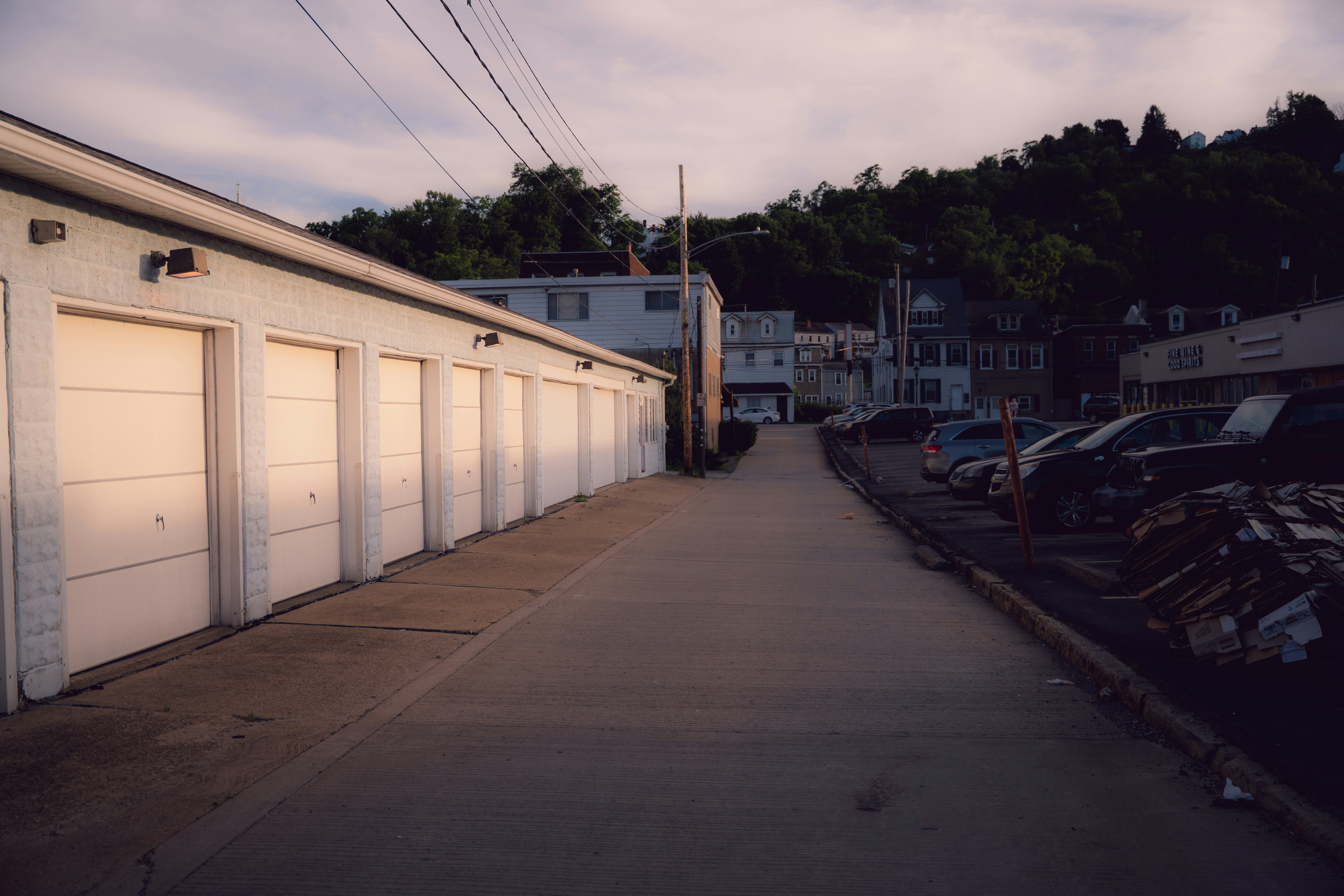 Row of garage doors fades into a quiet urban alley
