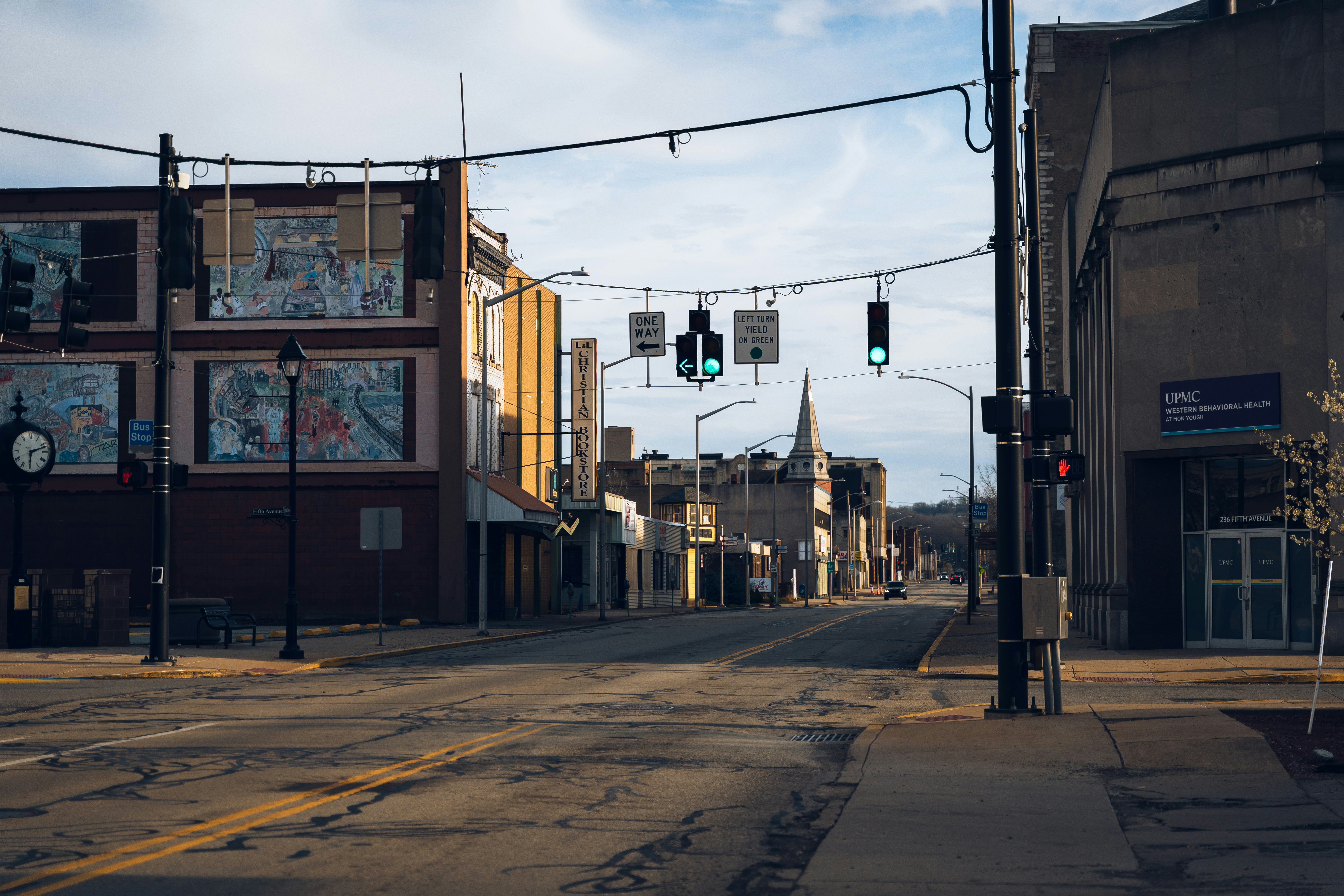 Dawn on a Quiet Main Street: Traffic Lights and Brick Facades