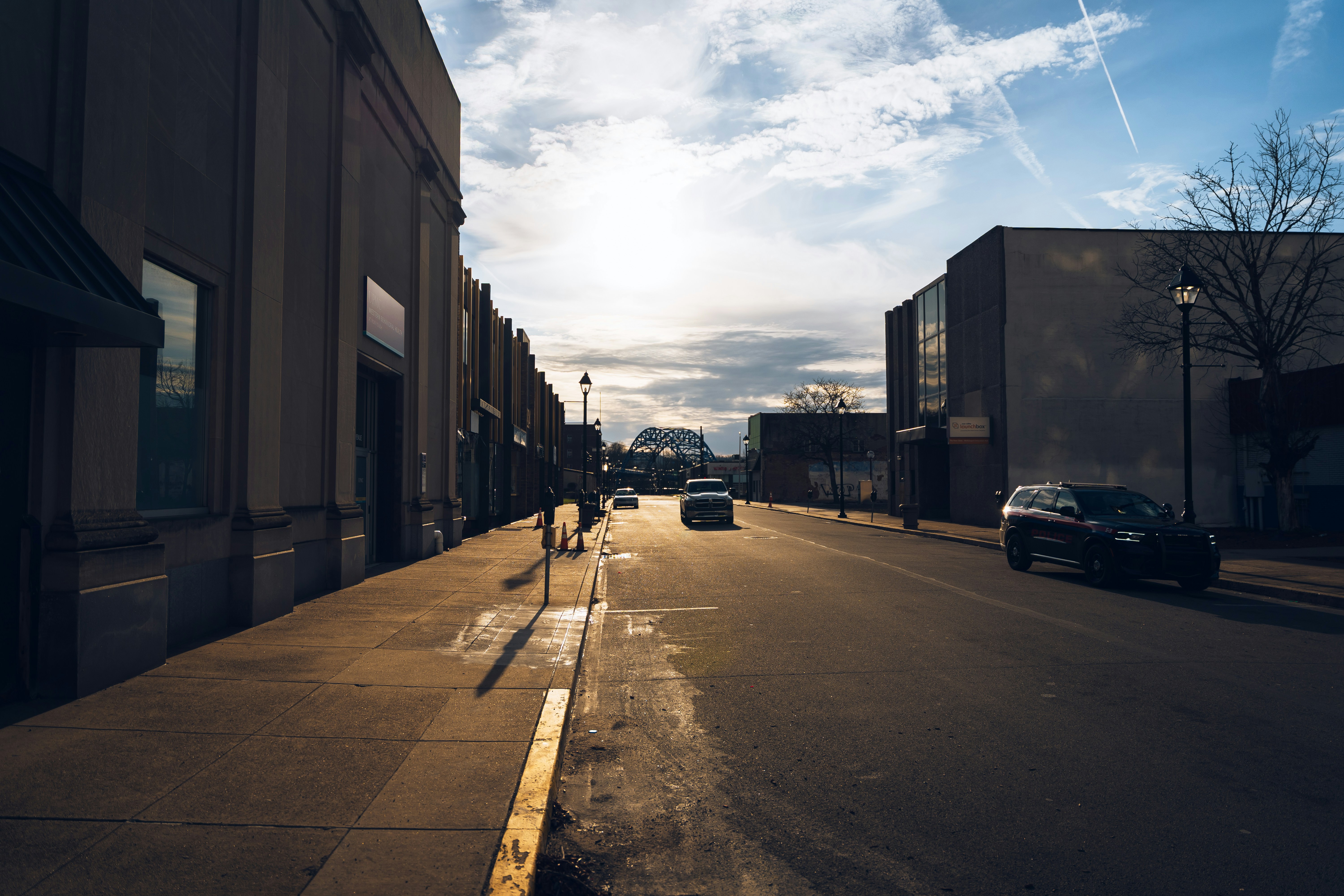 Sunlit Main Street: A Quiet Corridor Toward the Distant Crescent