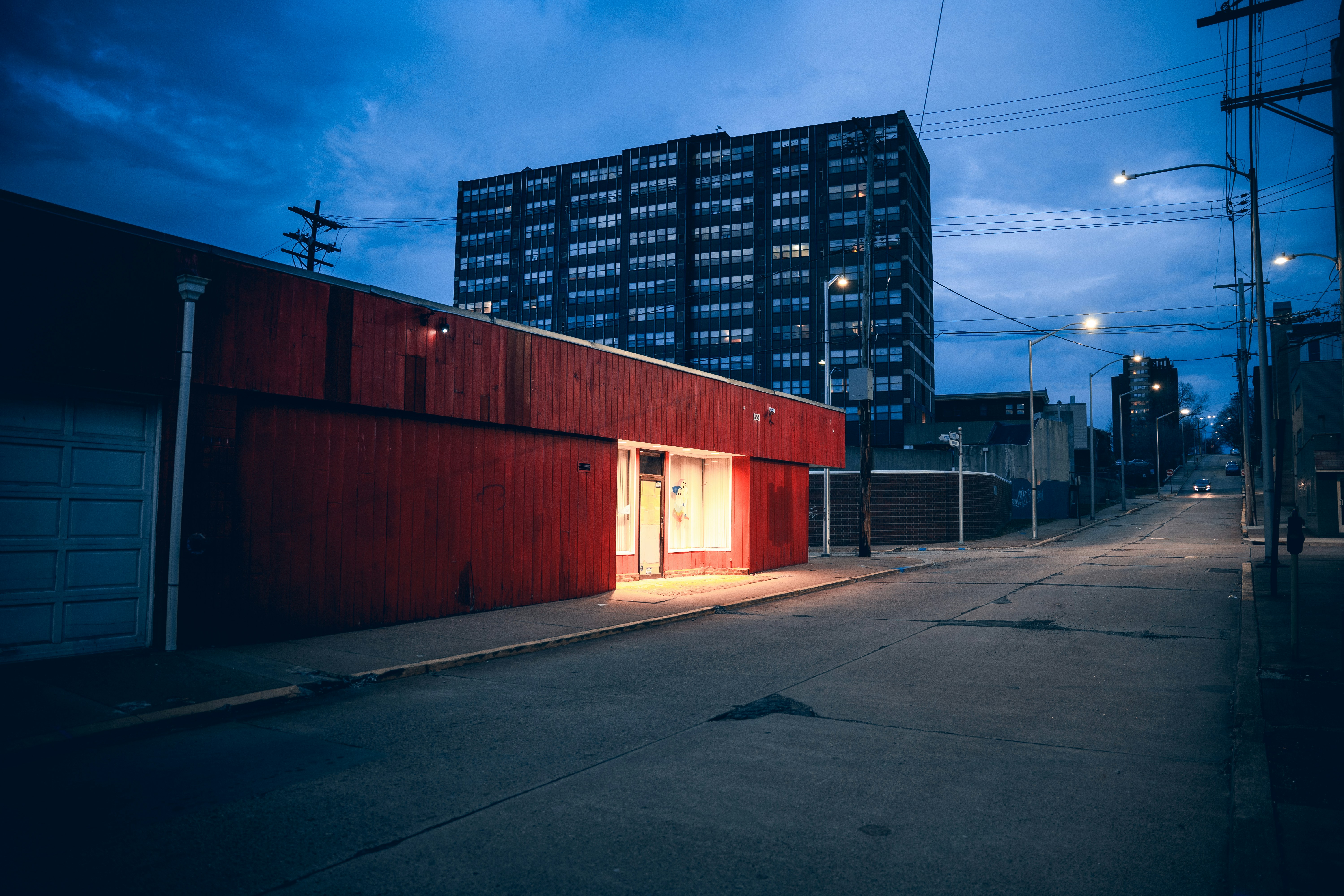 Neon-Edge Alley: Soft Light on a Red Facade