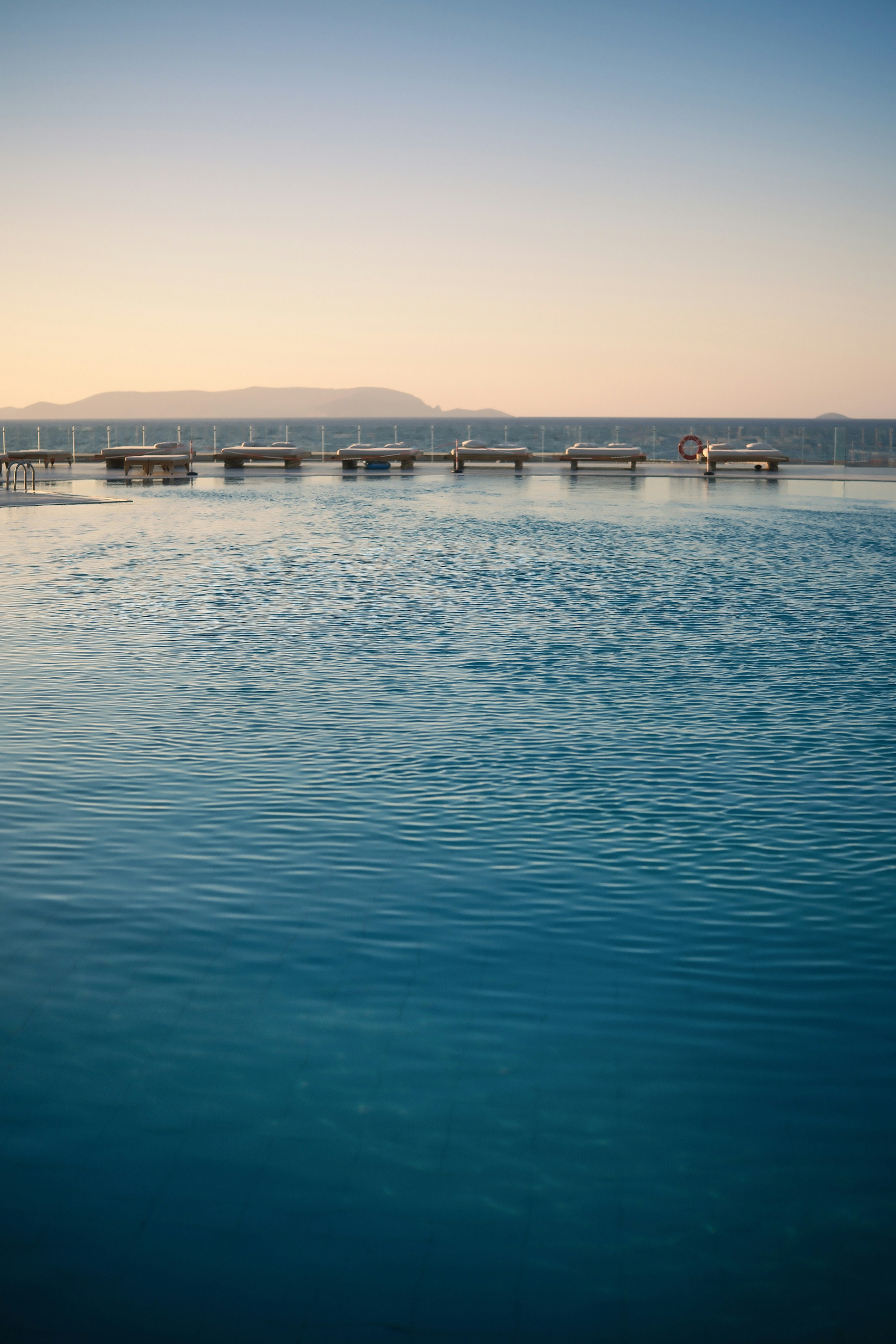 Sunset Over a Quiet Pier: A Horizon of Still Water