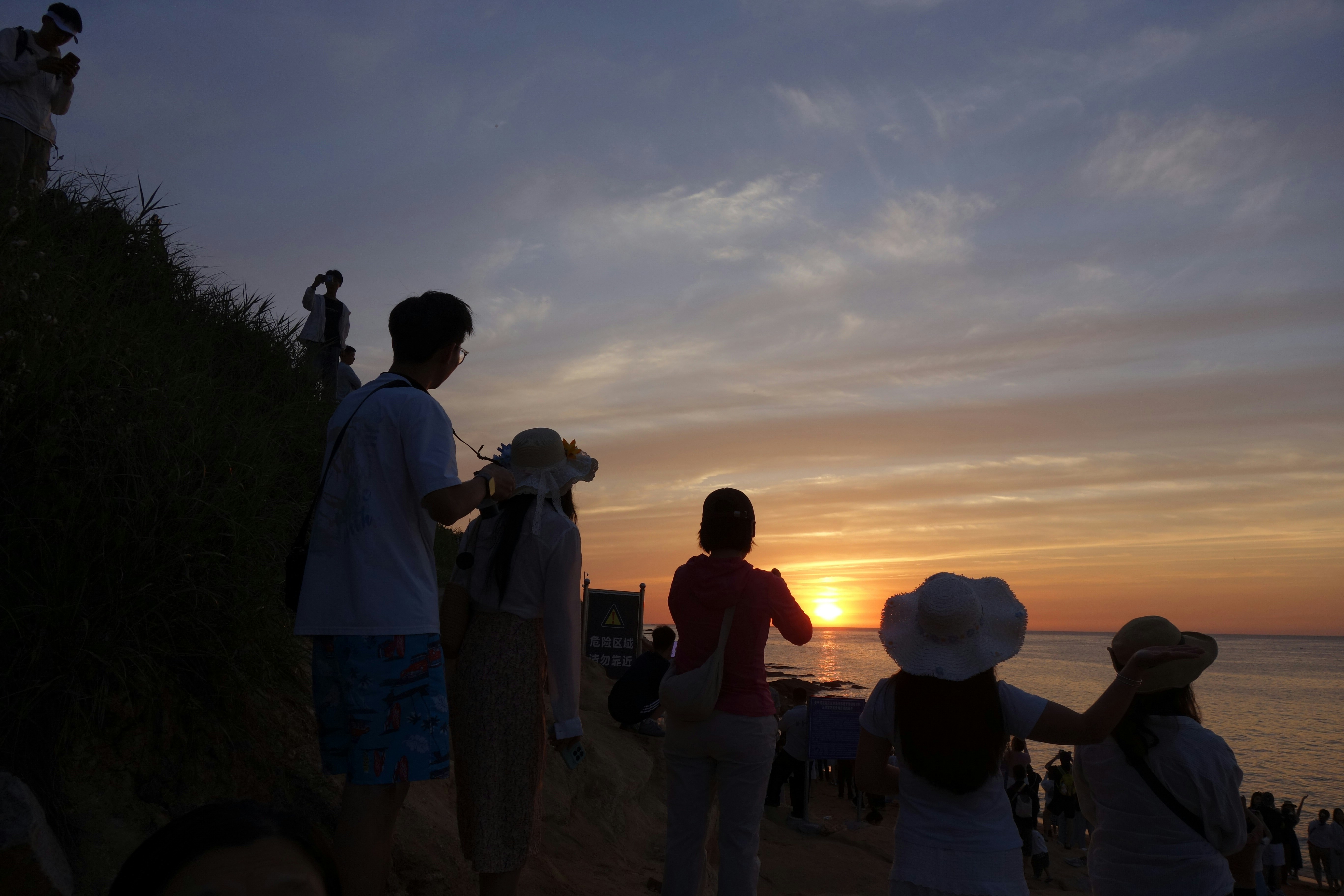 Sunset on the Dune: A Silhouette of Shoreline Moments