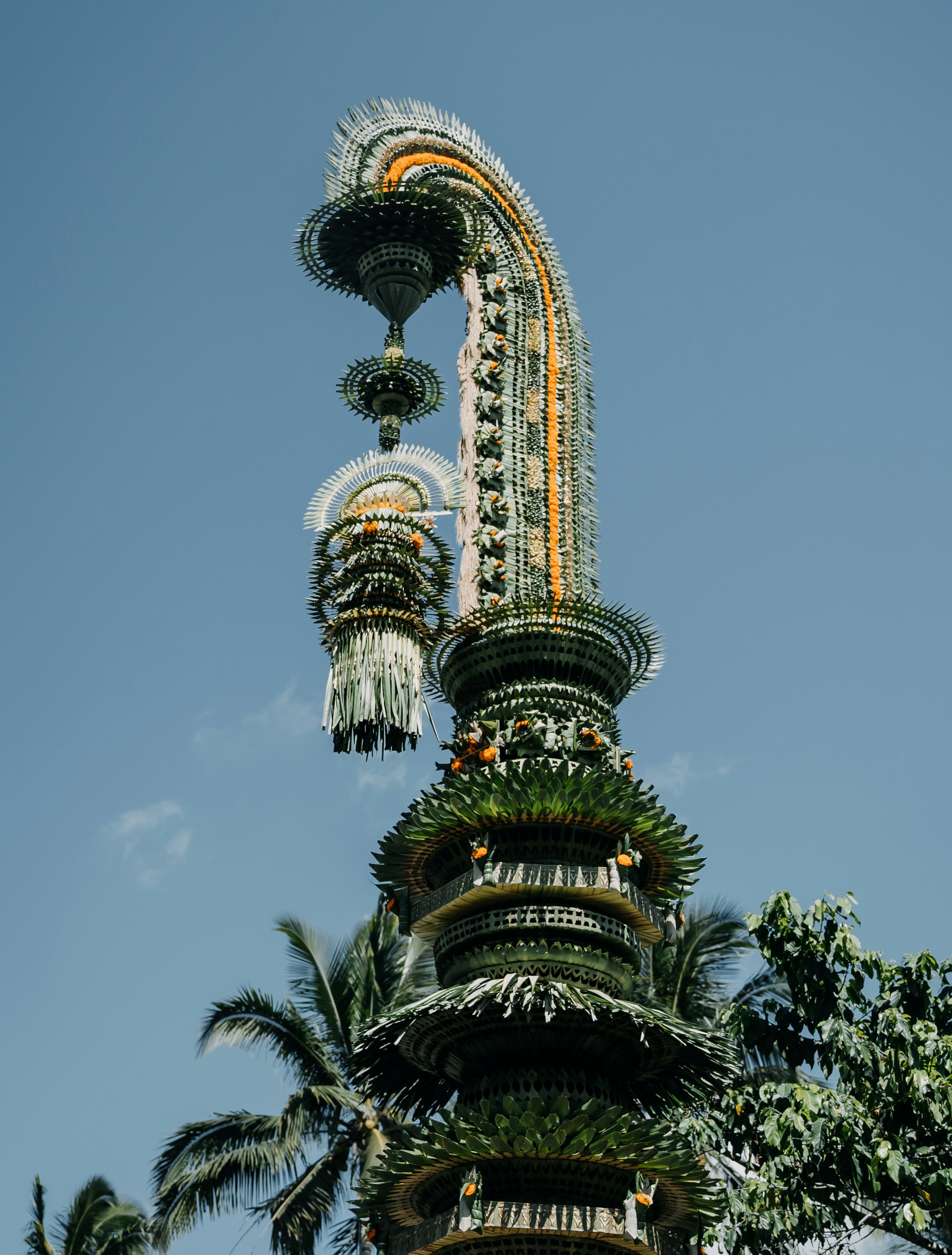 Sacred Spiral: A Monumental Carved Dancer Reaching Toward the Sky