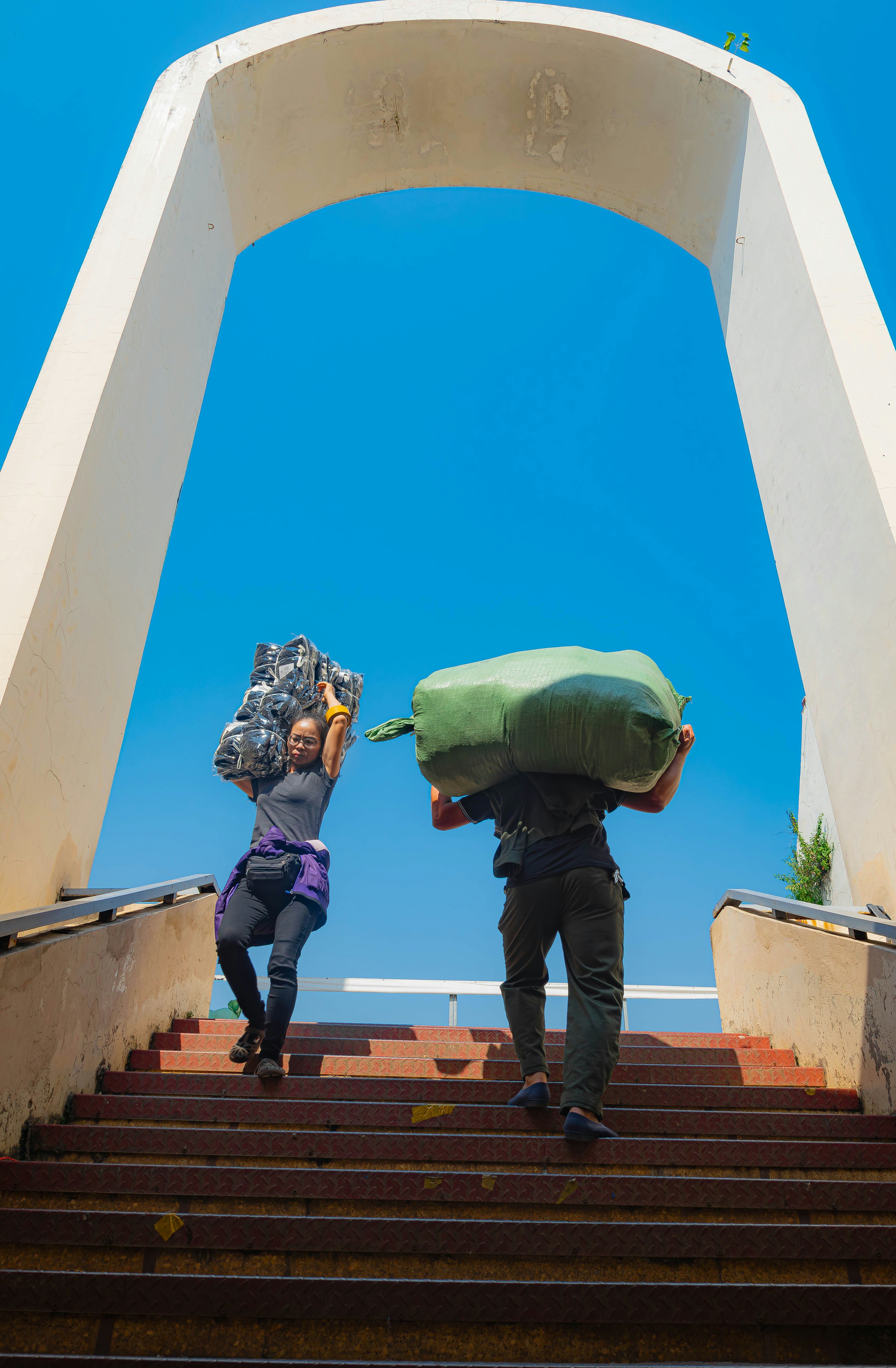 Arches of Strength: Climbers on a Bright Stairway