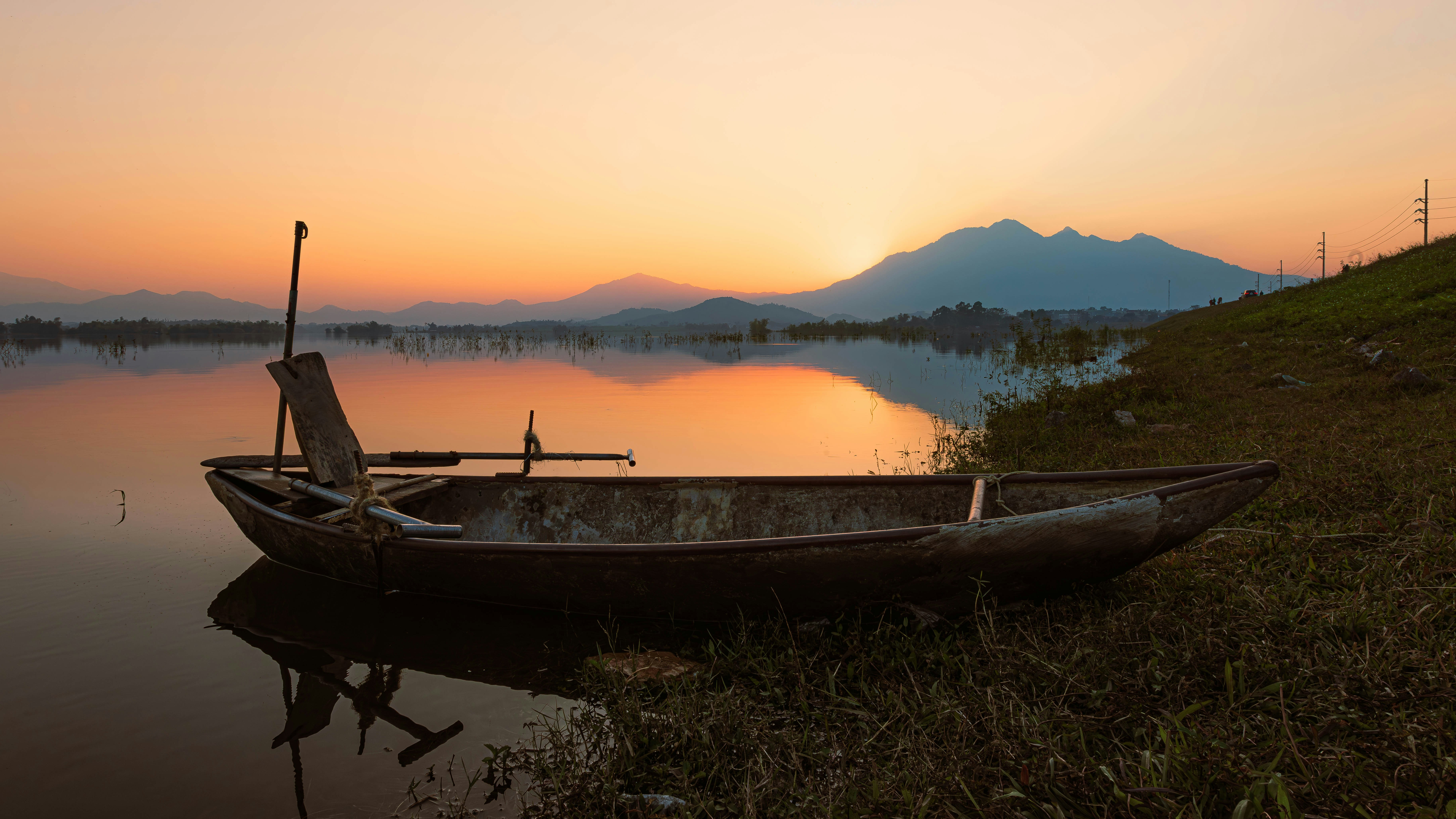 Ghost of the Dawn: A Lonely Boat at Quiet Water
