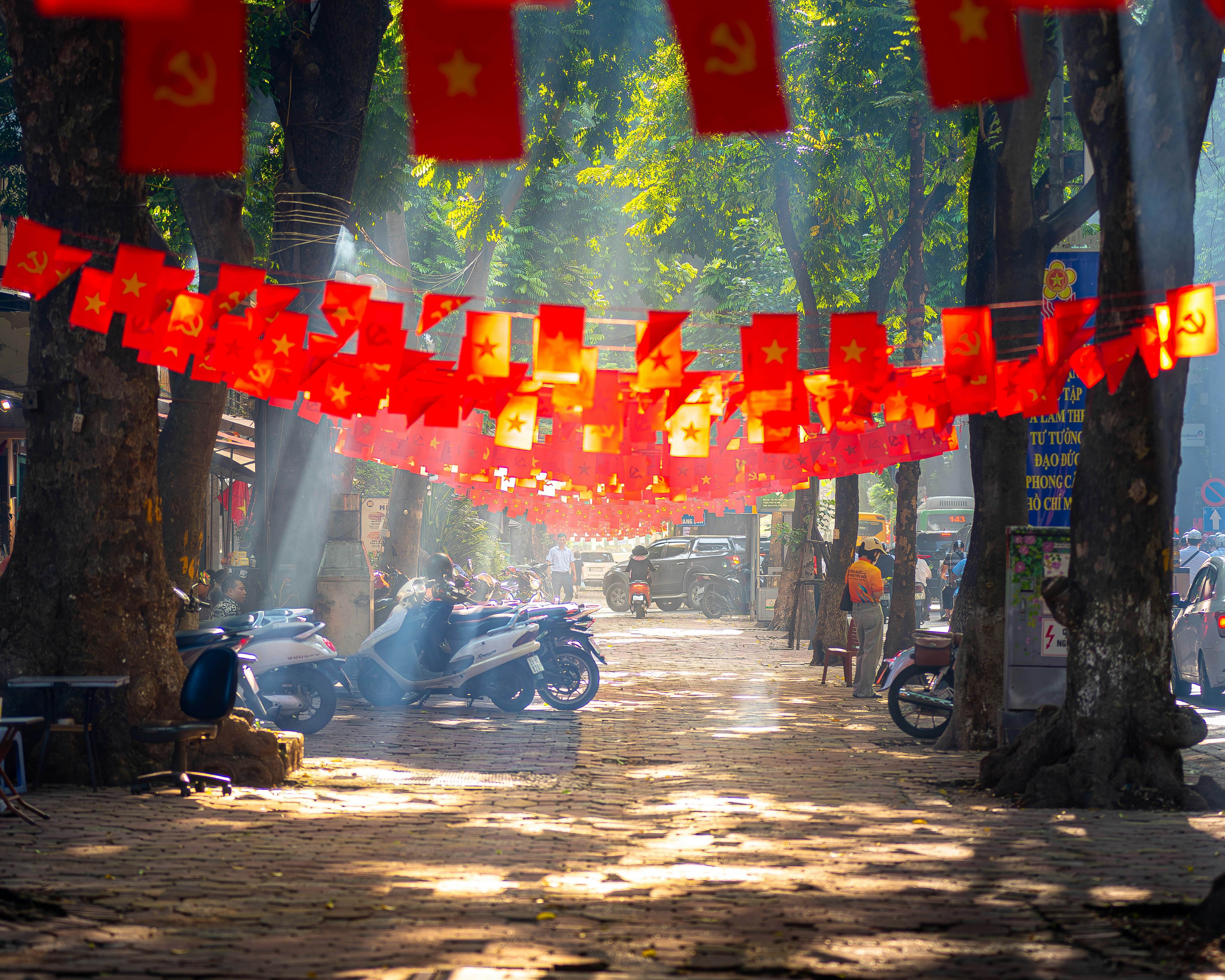 Sunlit Alley Under a Veil of Red Flags