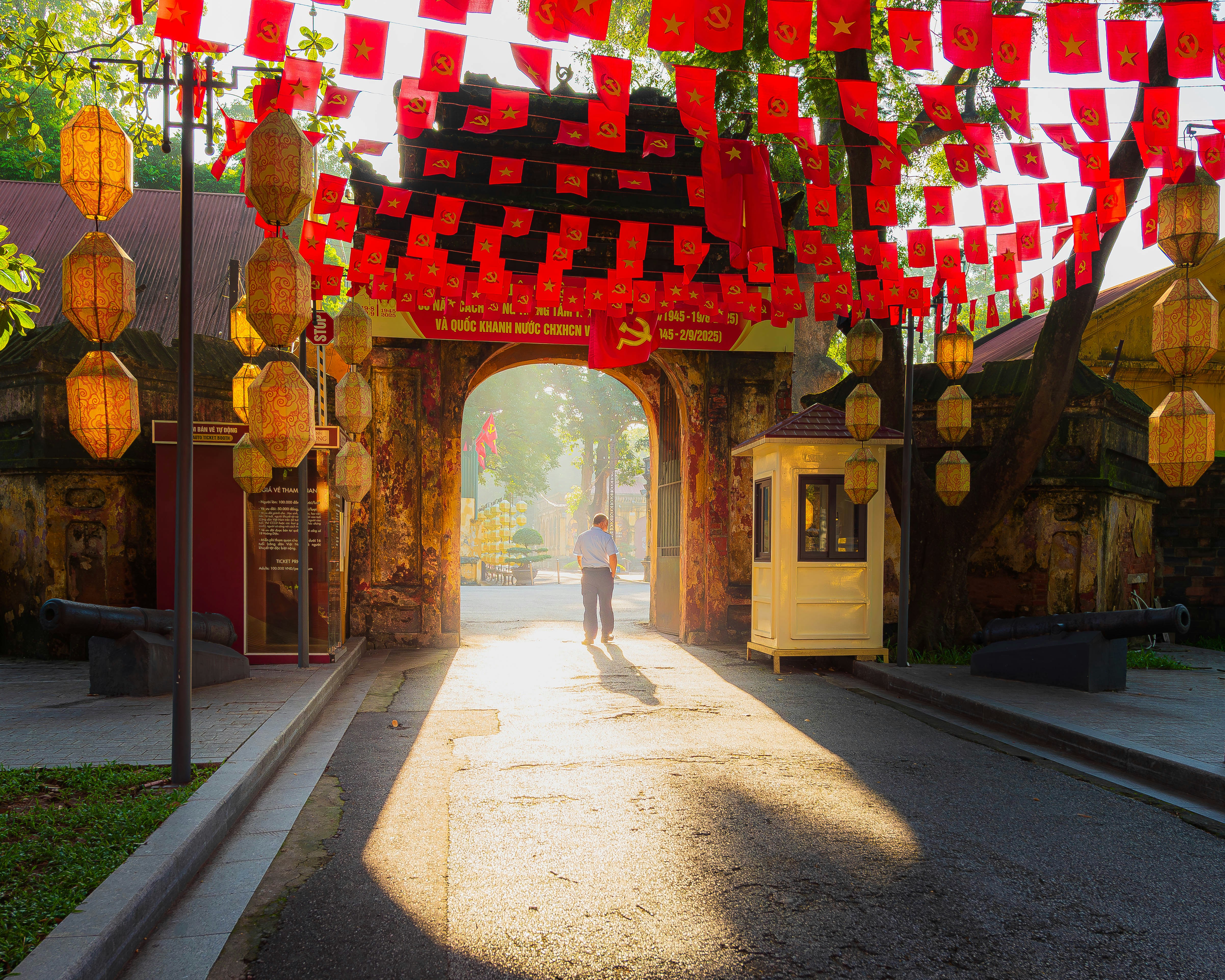 Lantern-lit Archway: A Persona in the Sunlit Path
