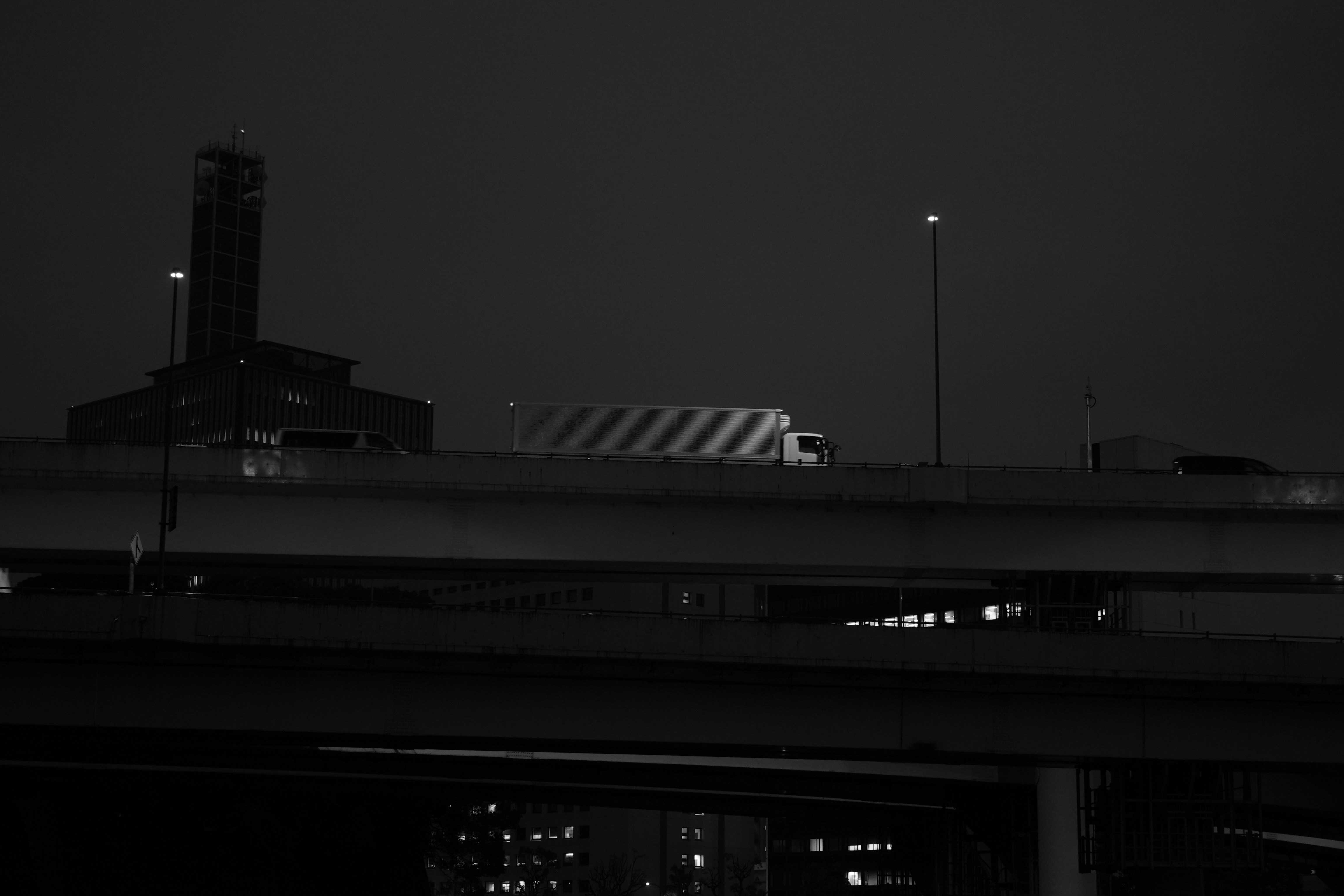Midnight Crossings: A Quiet Night Over the City’s Ribs