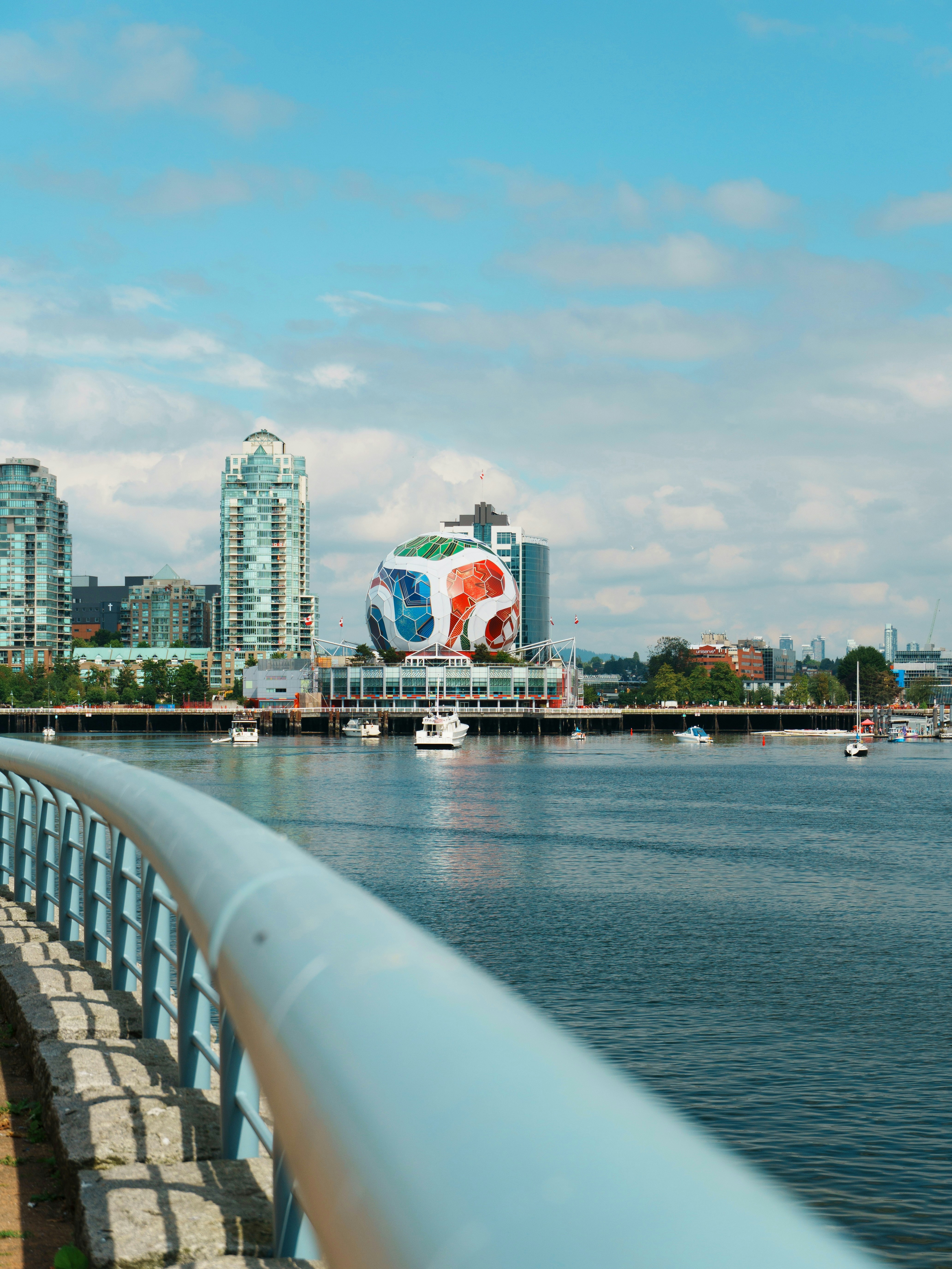Floating Mosaic: Colorful Sphere Over the Waterfront