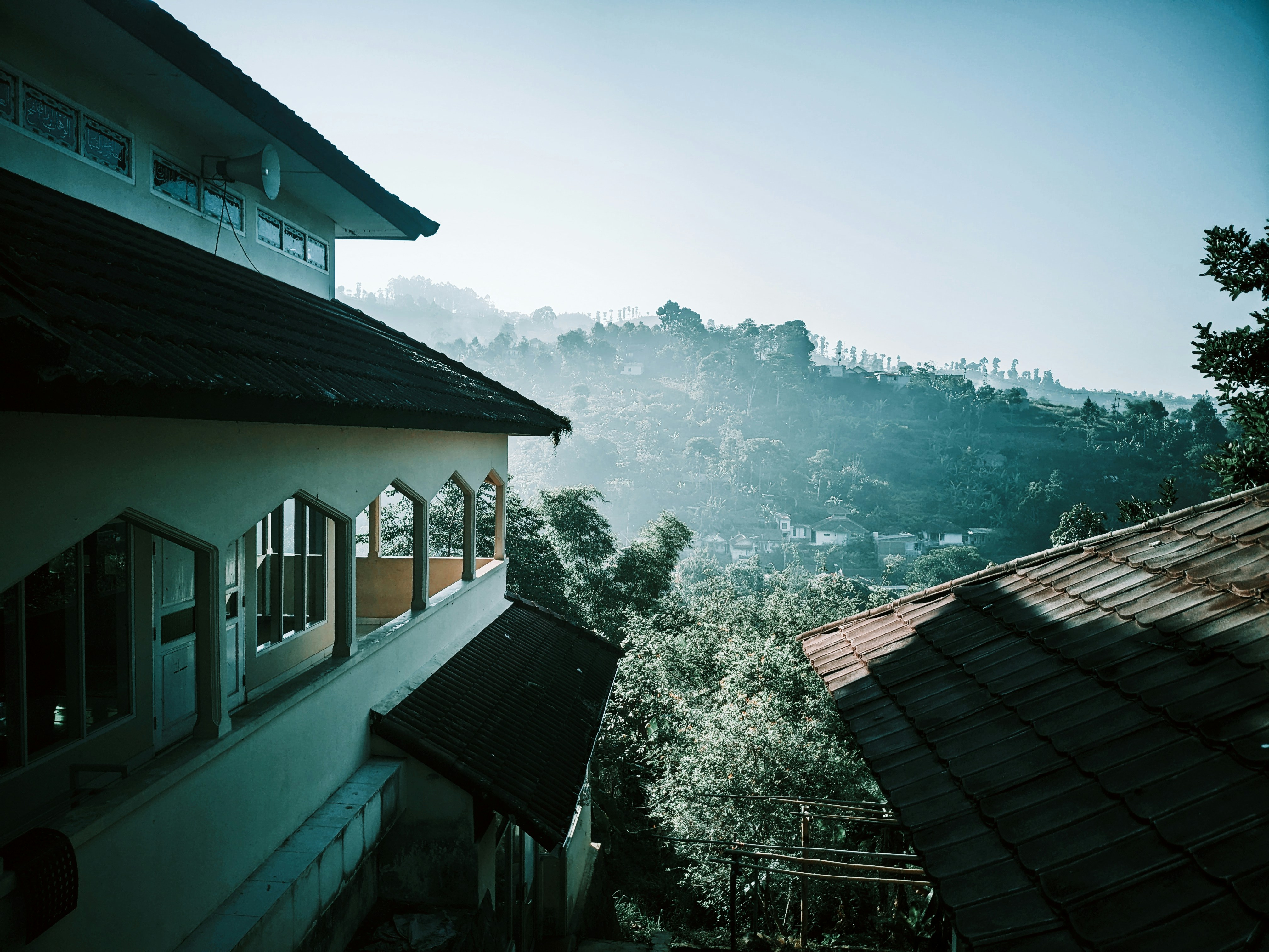 Terraced Rooflines Framing a Misty Valley
