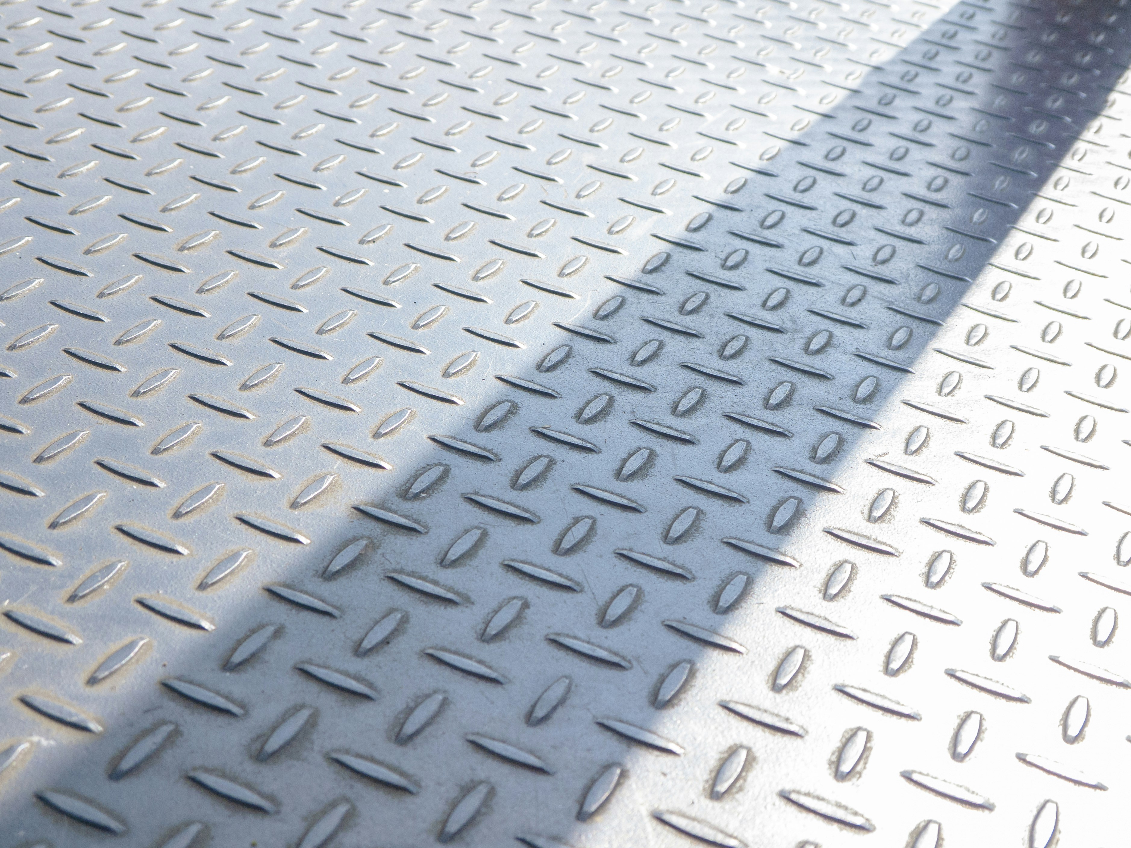 Industrial Light: Diamond Plate in Sunlit Glare
