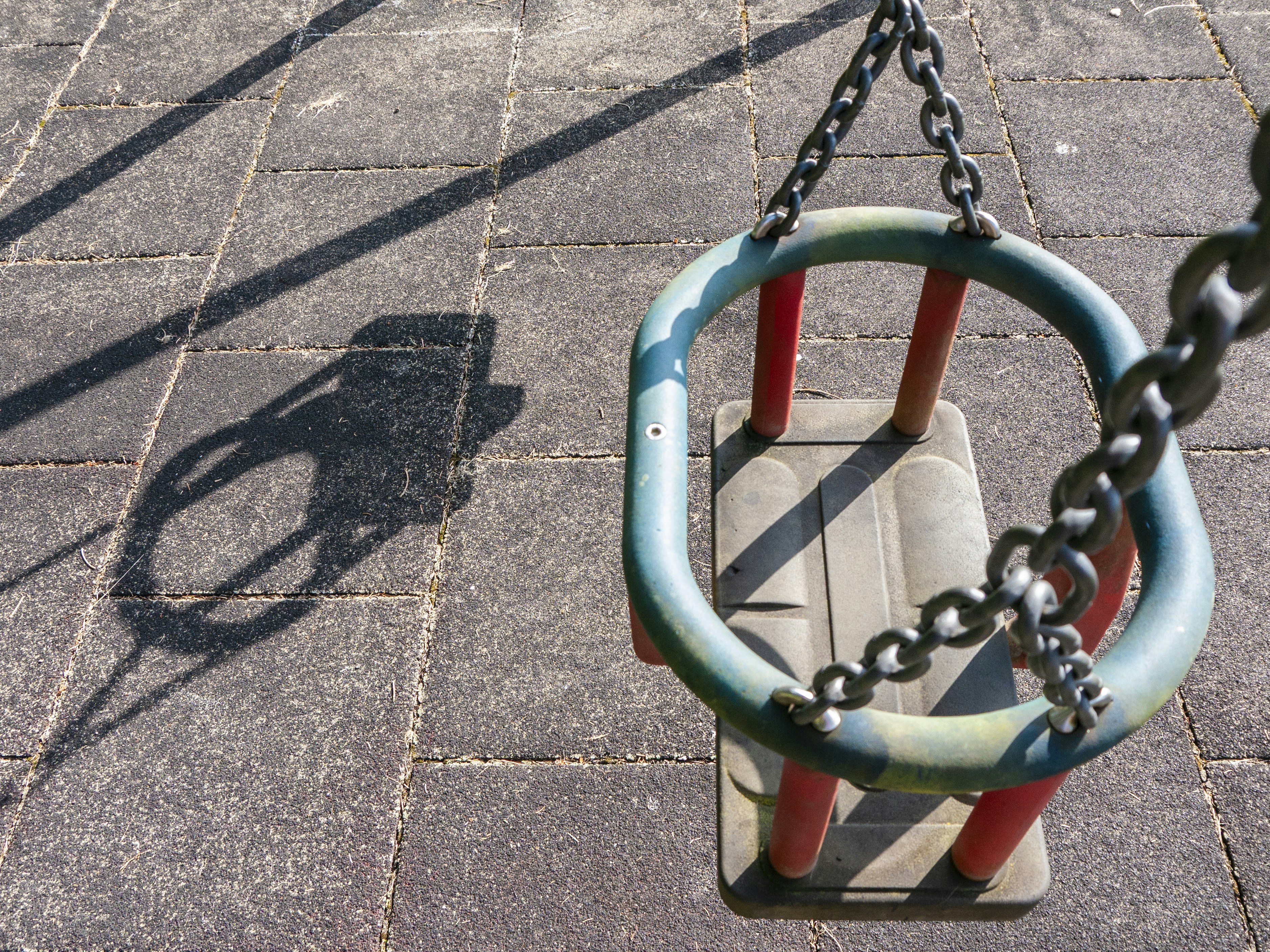 Shadowed Swing Ring: Chains and Circles in a Quiet Playground