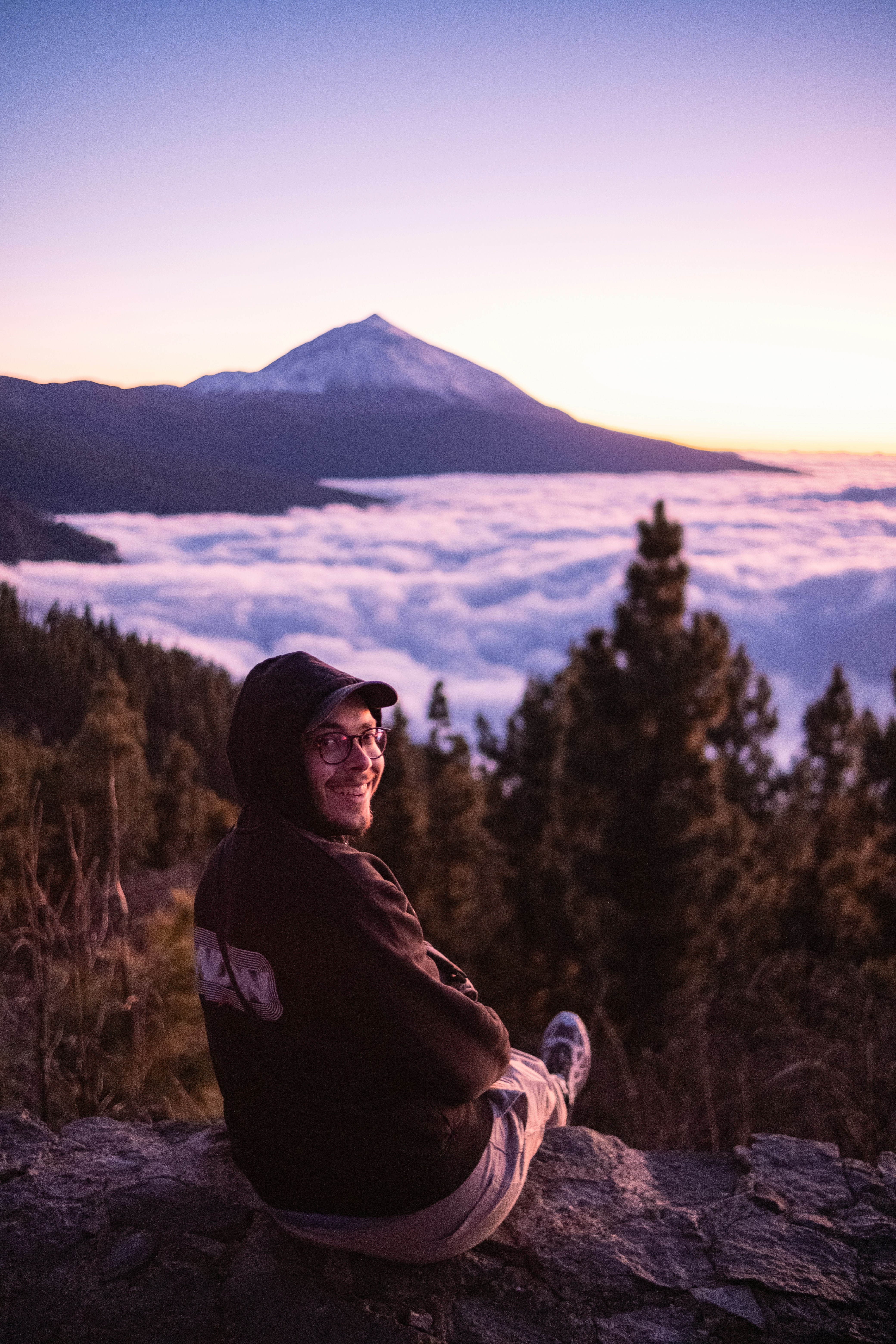 Sunrise Over a Sea of Clouds: Mountain View with Seated Hiker