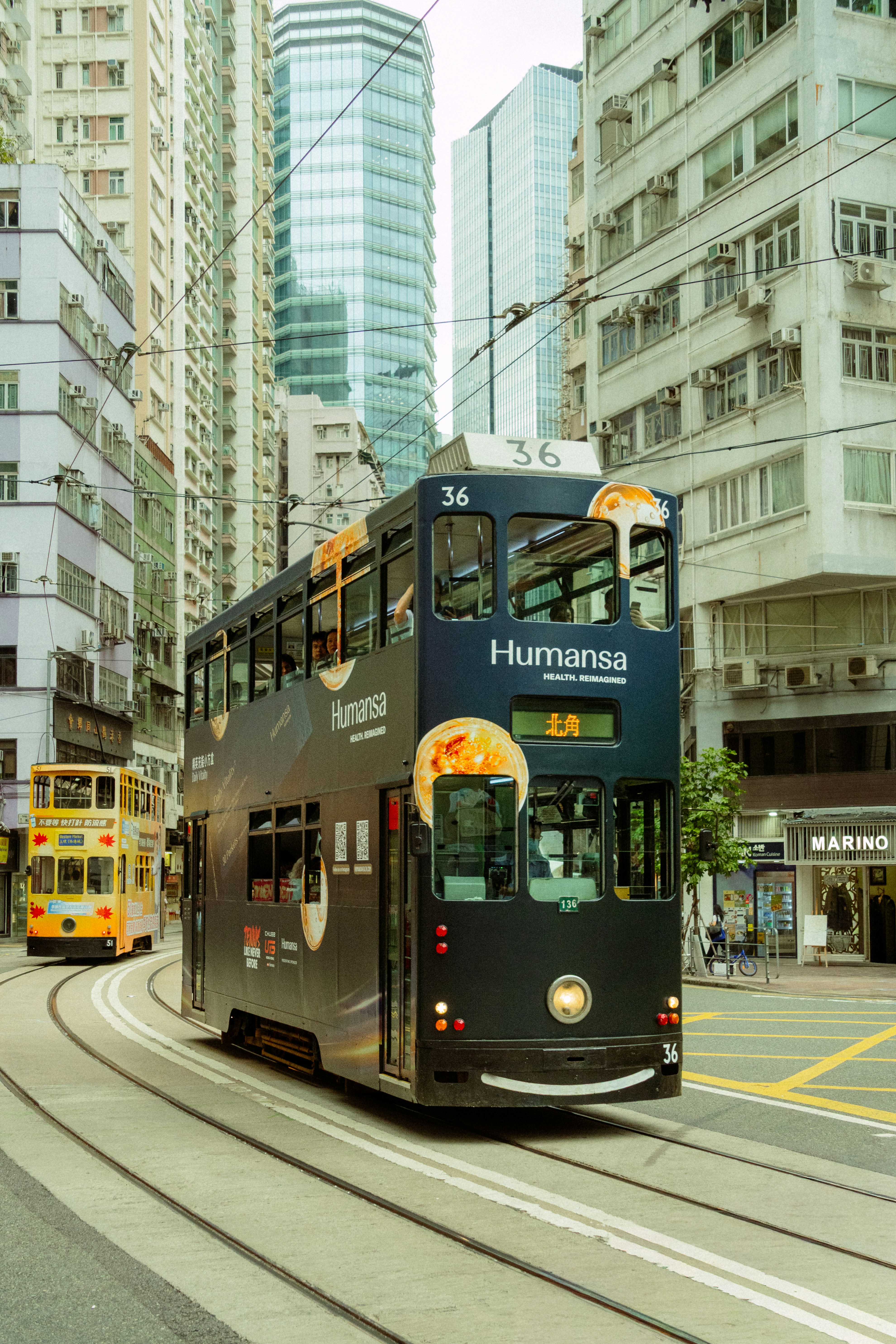Heritage Meets Horizon: The Double-Deck Streetcar in a Concrete Canyon