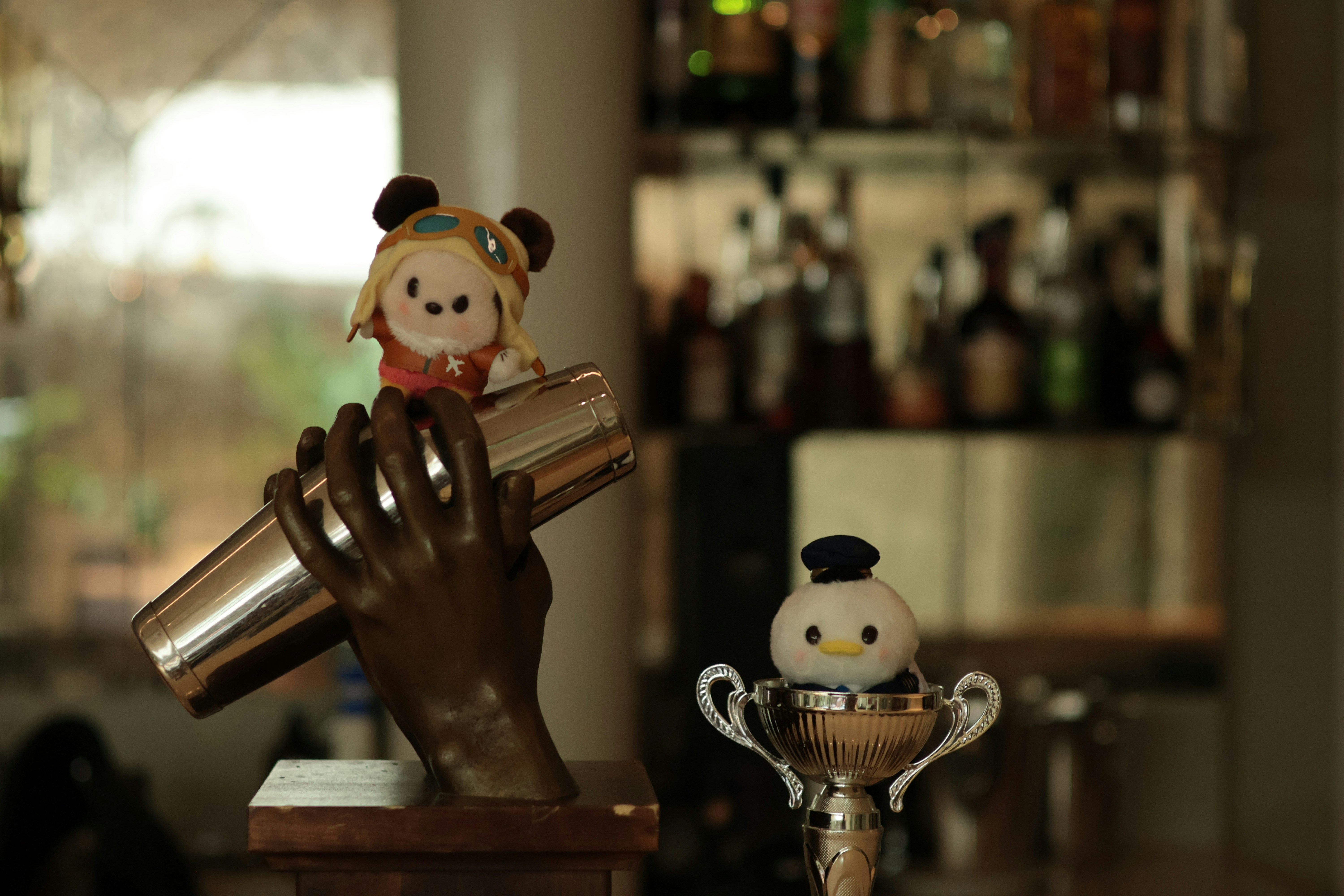Playful Snowy Mascots at the Bar Balance