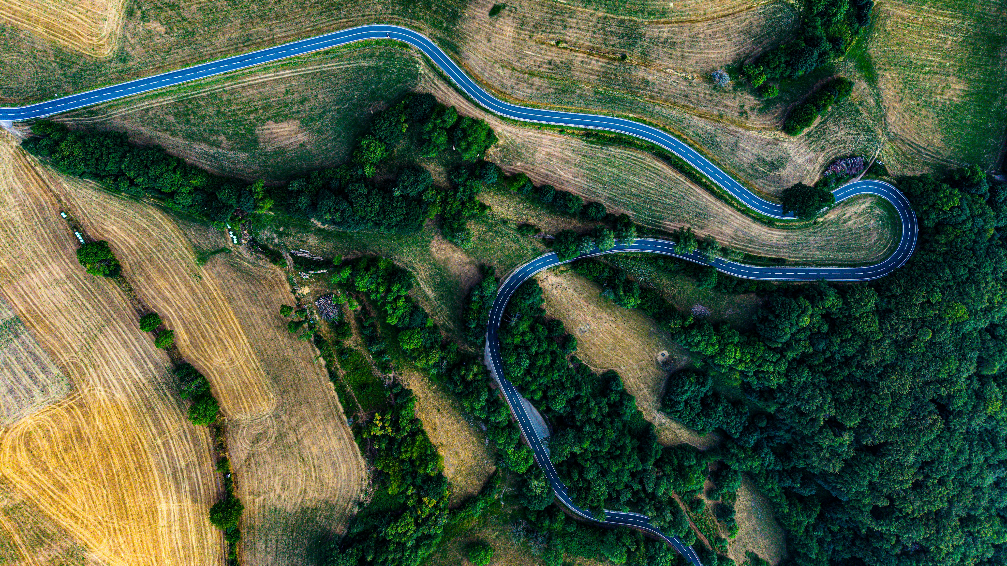 Winding ribbon: A serpentine road skims the hillside