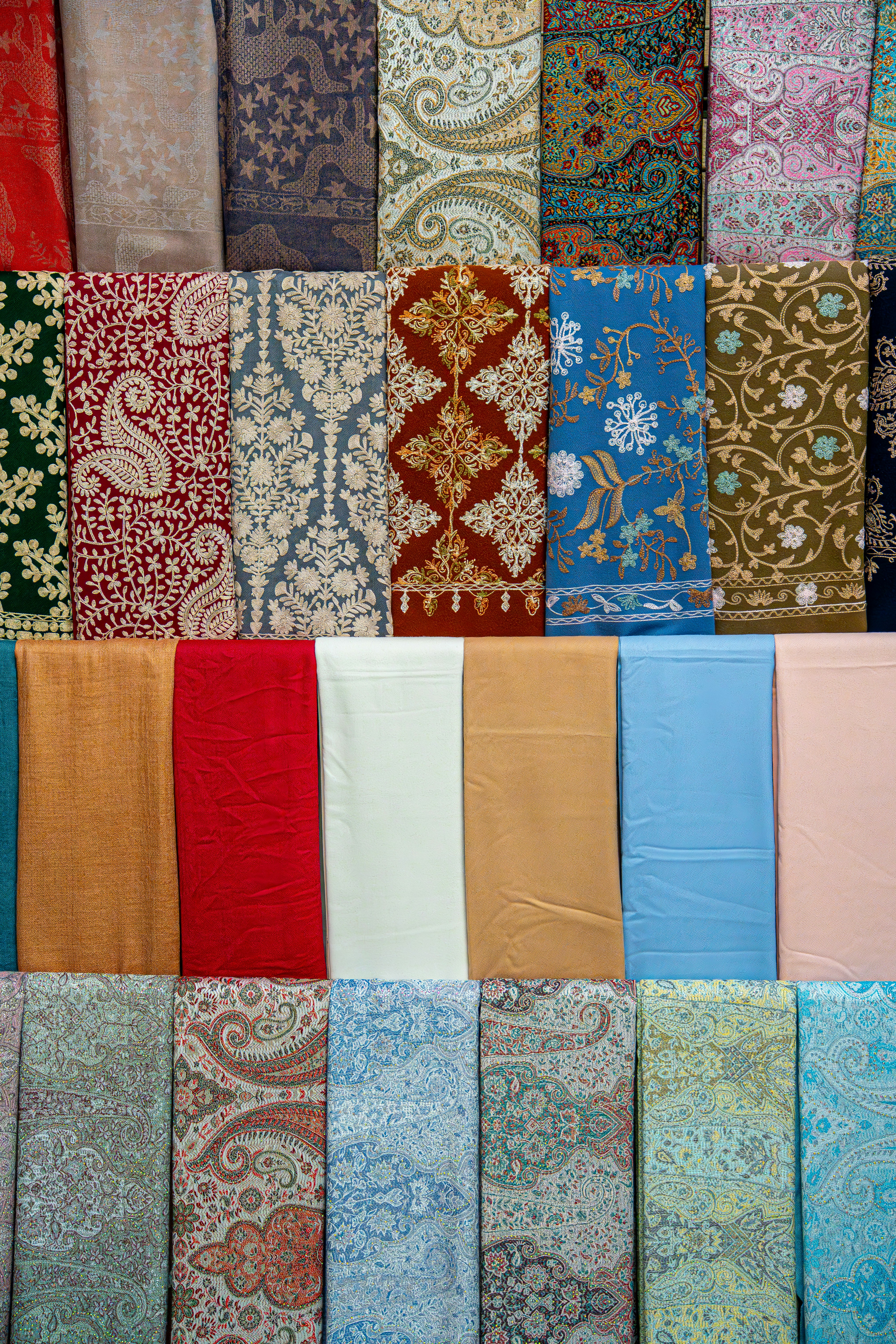 Colorful Fabric Gallery: Patterned and Solid Textiles Arrayed in Rows