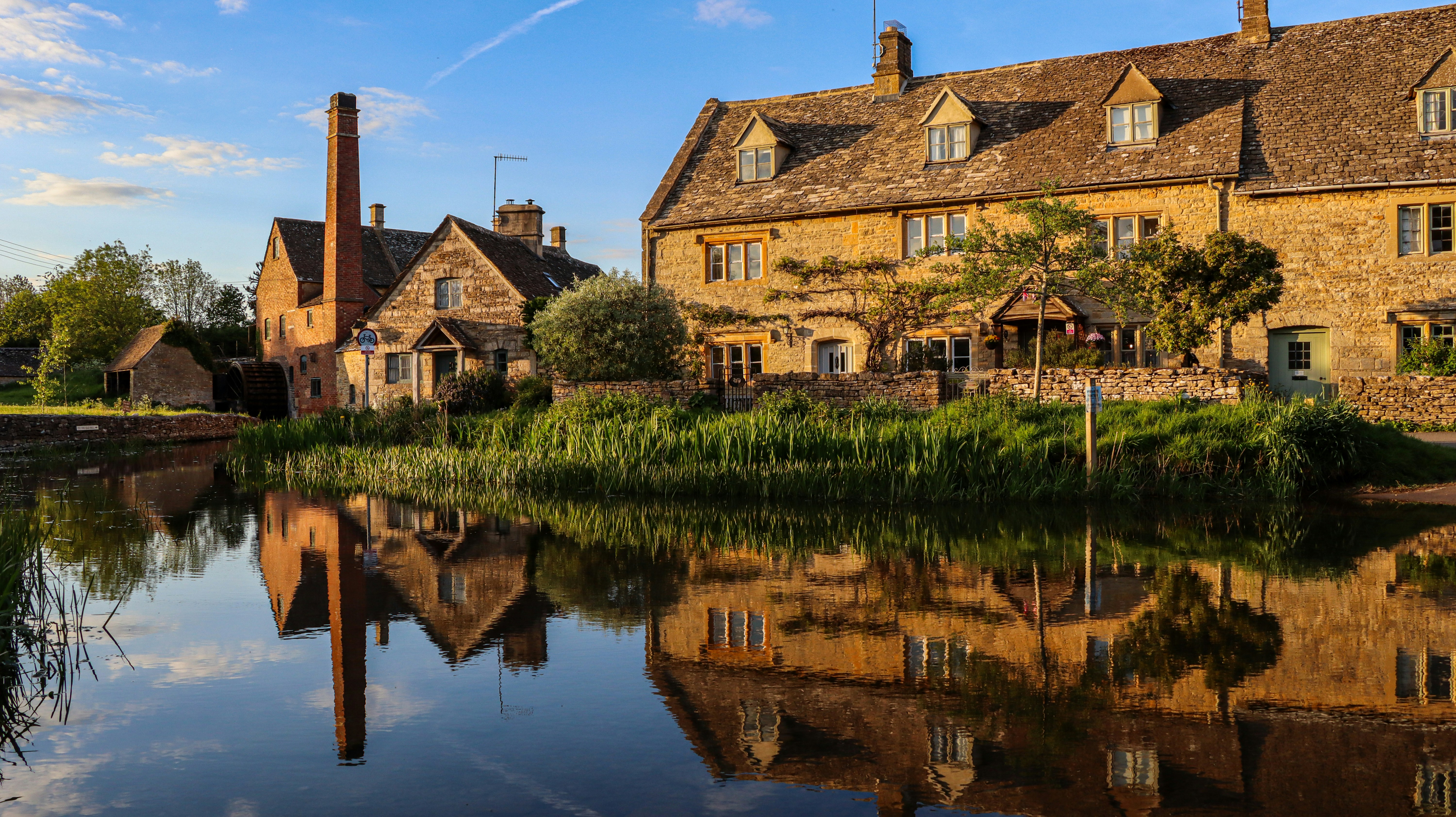 Quaint Riverside Manor Reflections at Golden Hour