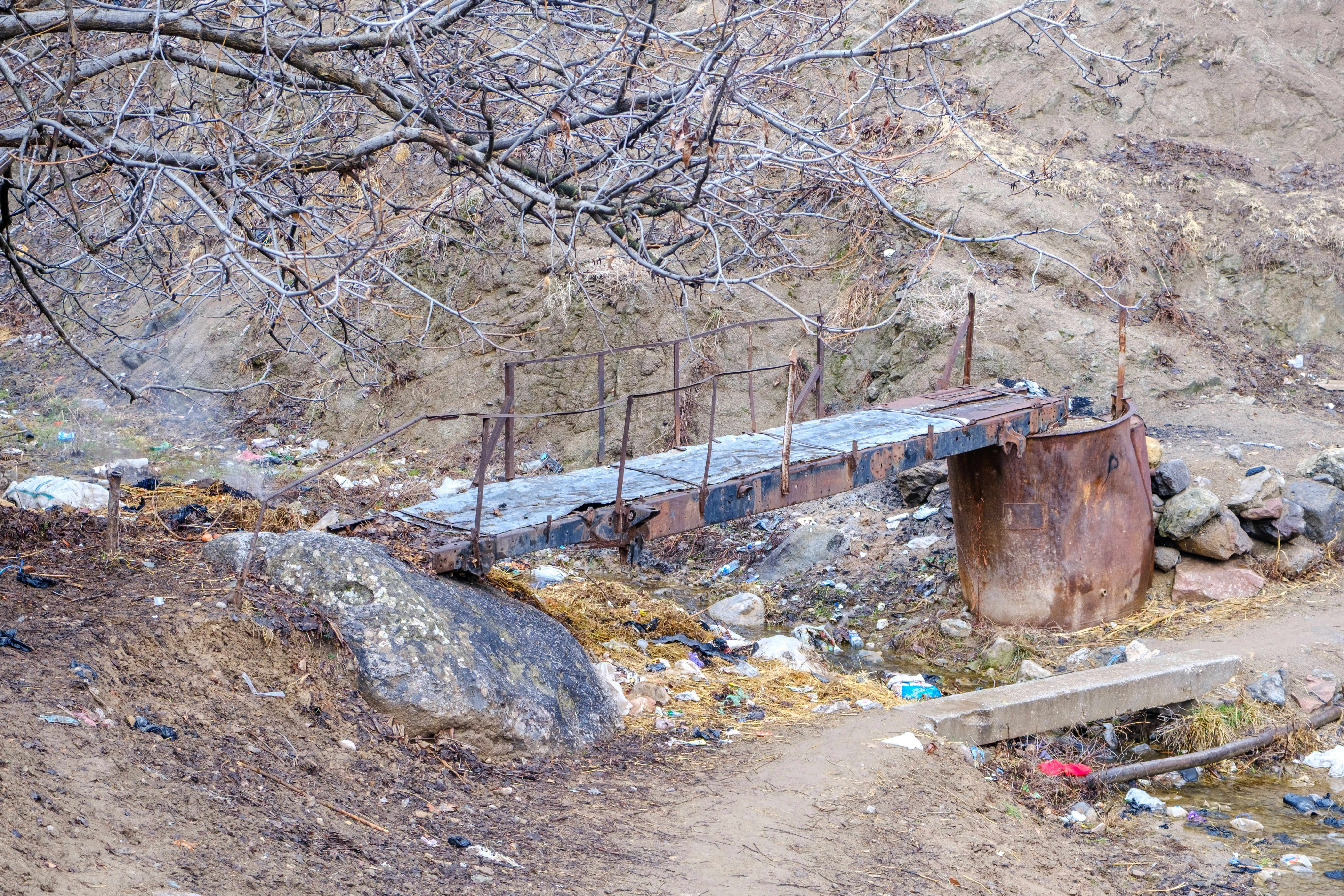Rusted Walkway over a Worn-Out Patch of Terrain