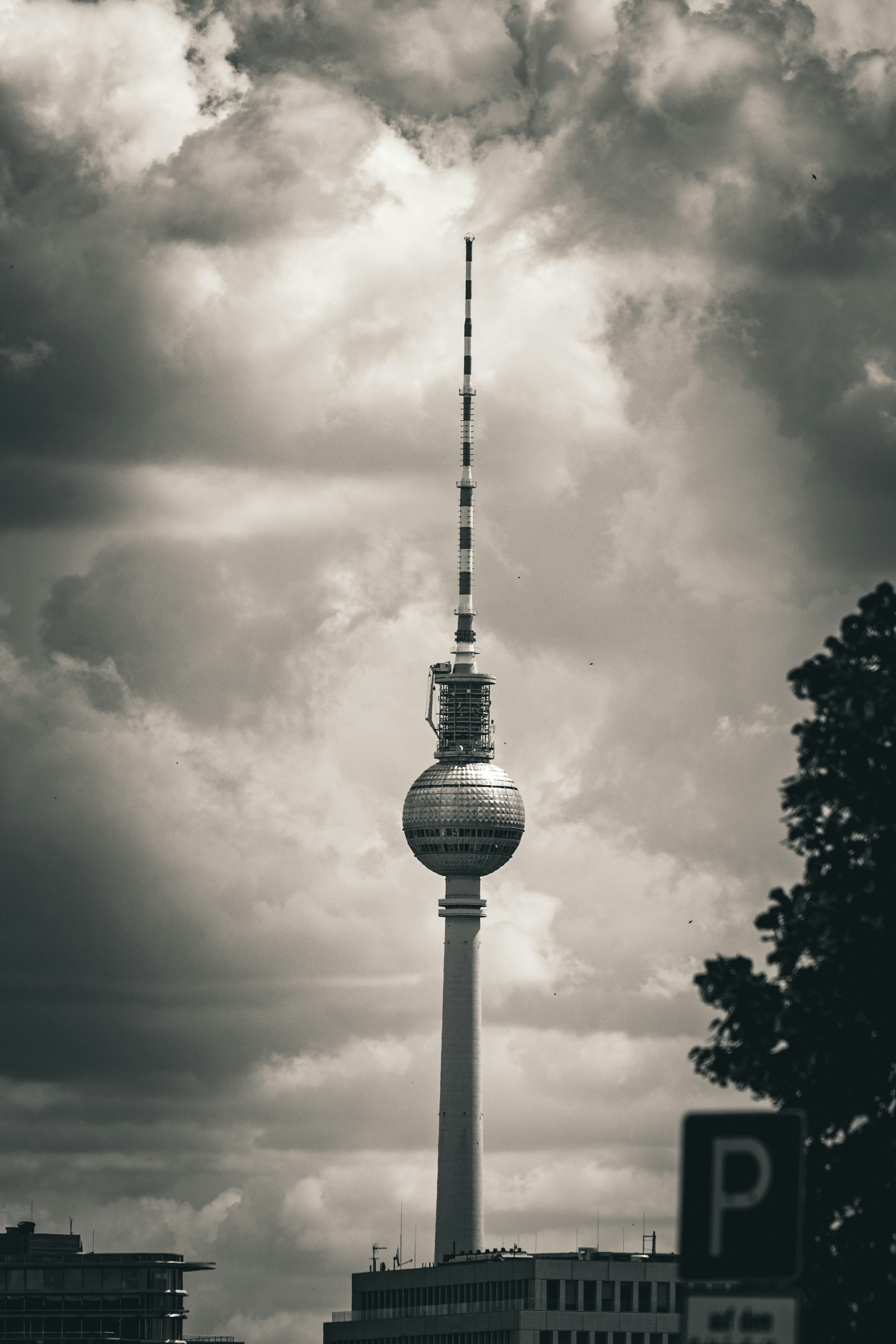 Berlin’s Needle: The Telekom Tower Piercing a Sky of Clouds