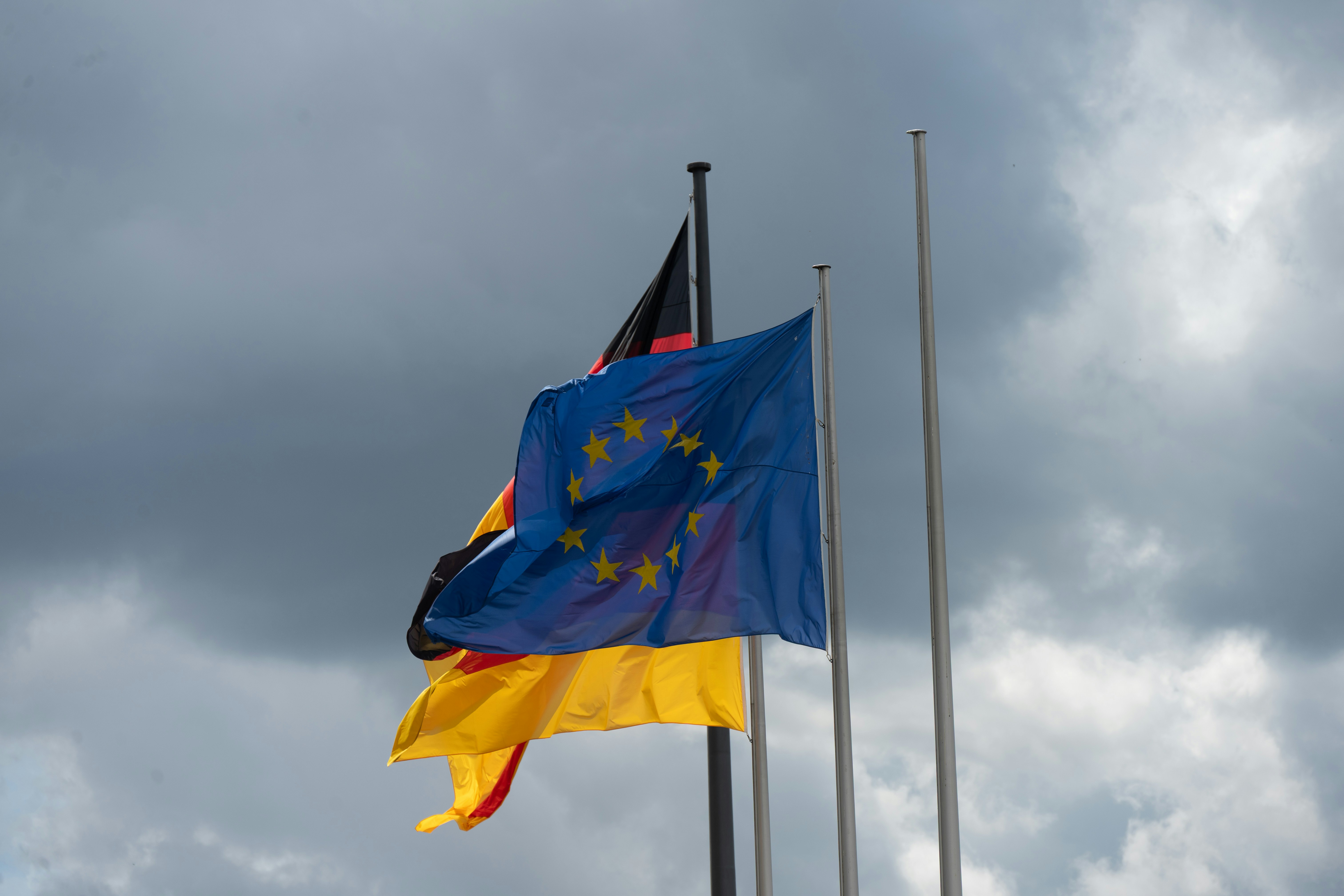 Flags in the Wind Over a Cloudy Sky