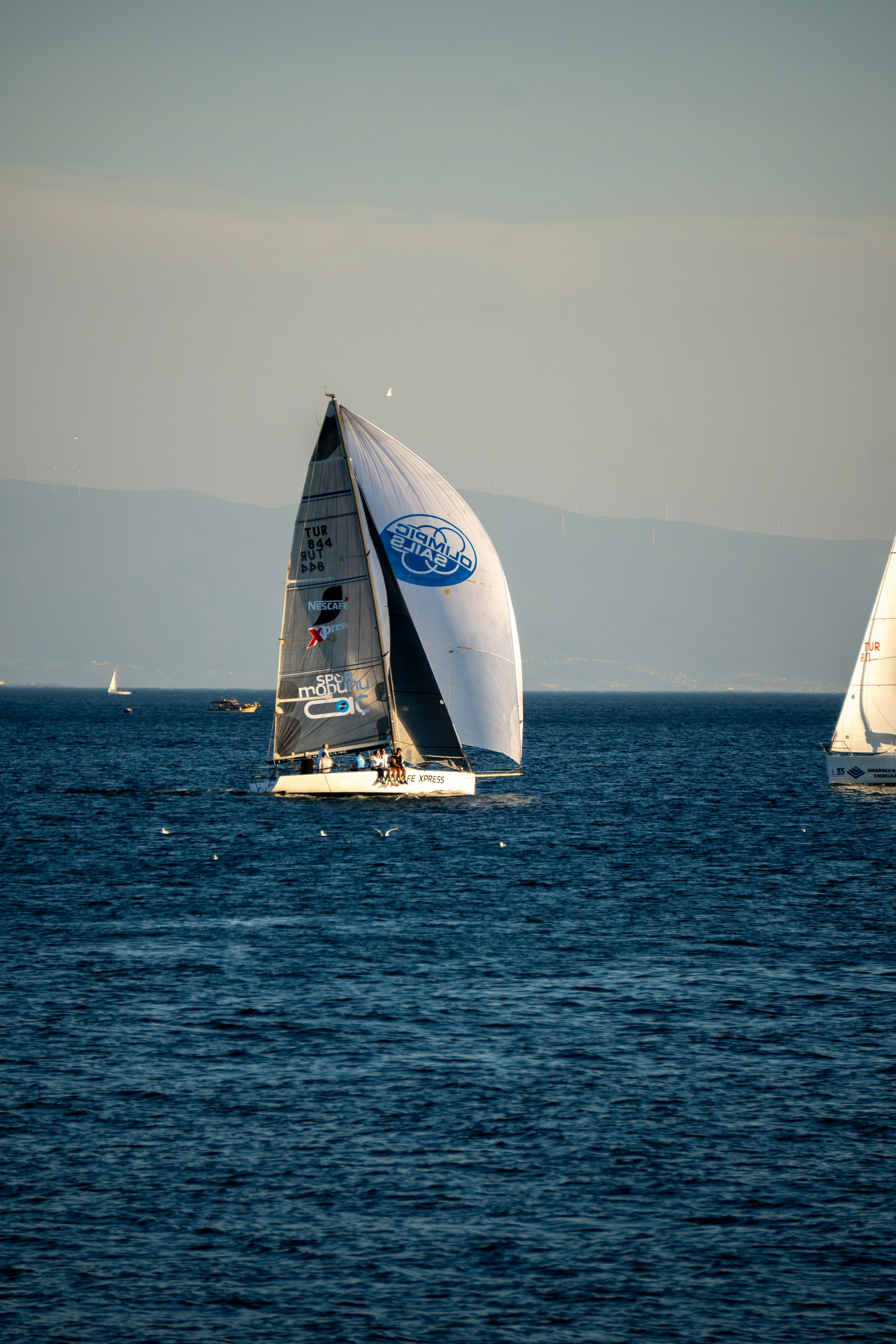 Sailing Portrait: A Cutter Heels Through Blue Silence