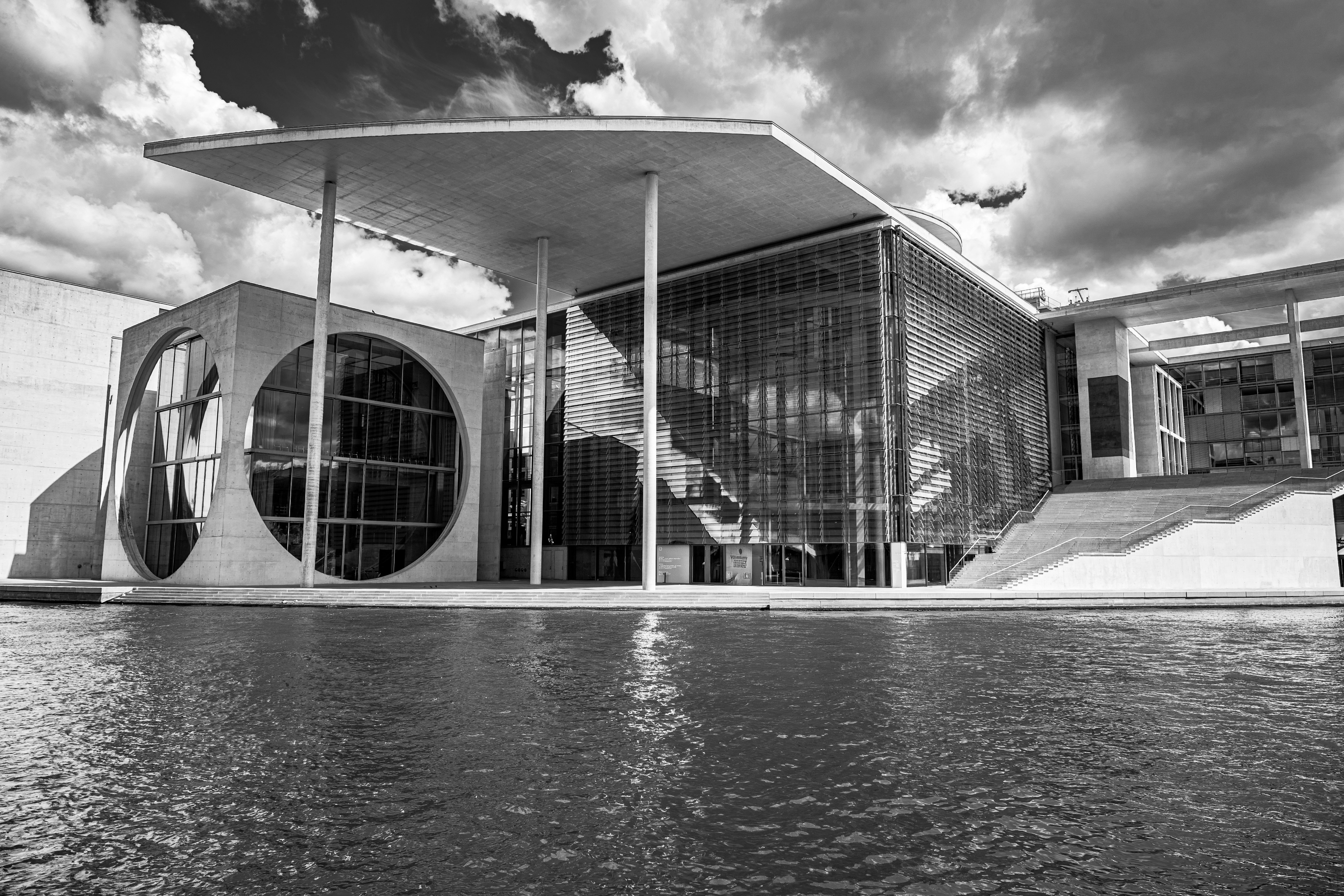 Concrete Modernism by the Water: A Geometric Facade at Dusk