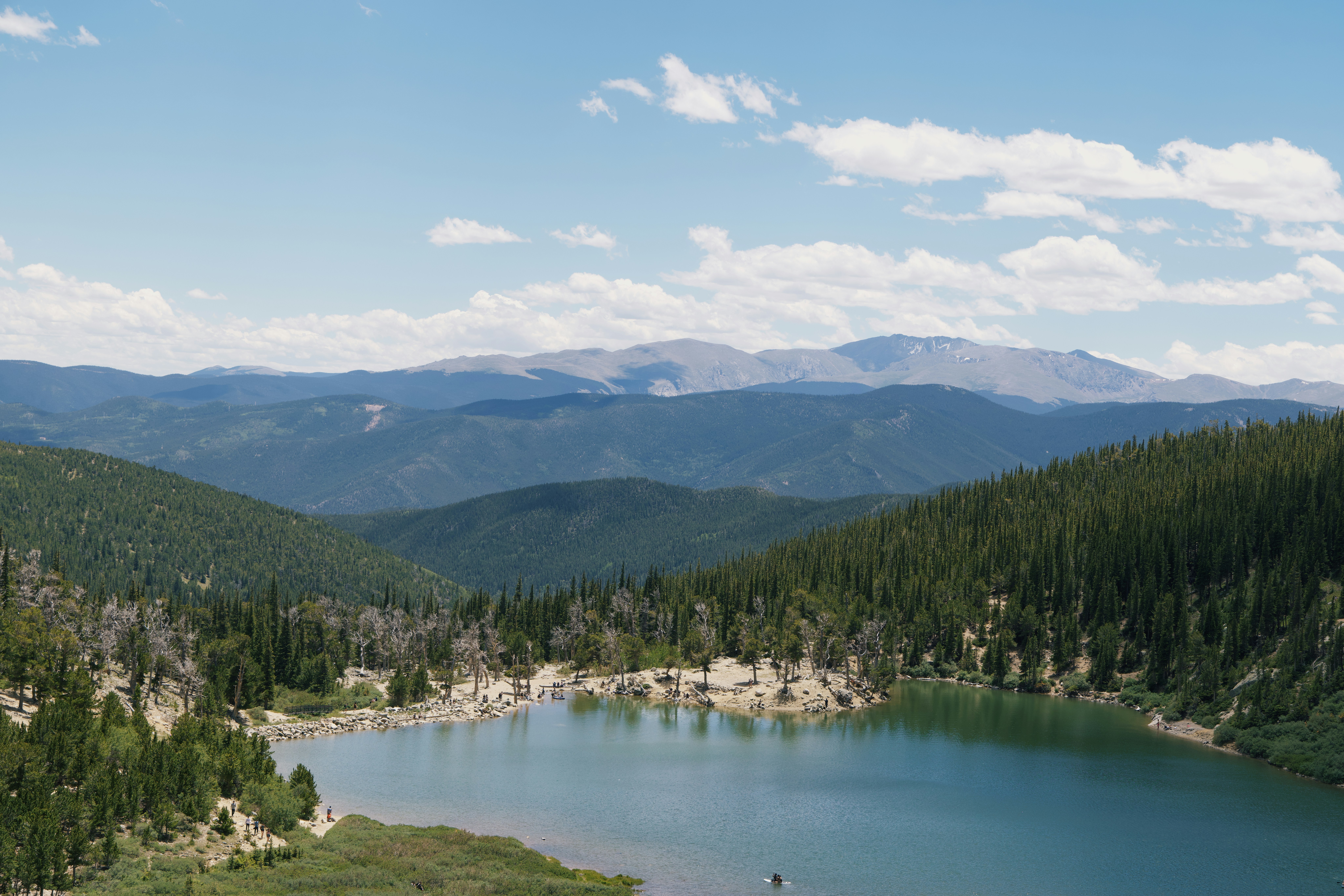 Green Basin Overlook: A Serene Mountain Lake Amid Conifer Peaks