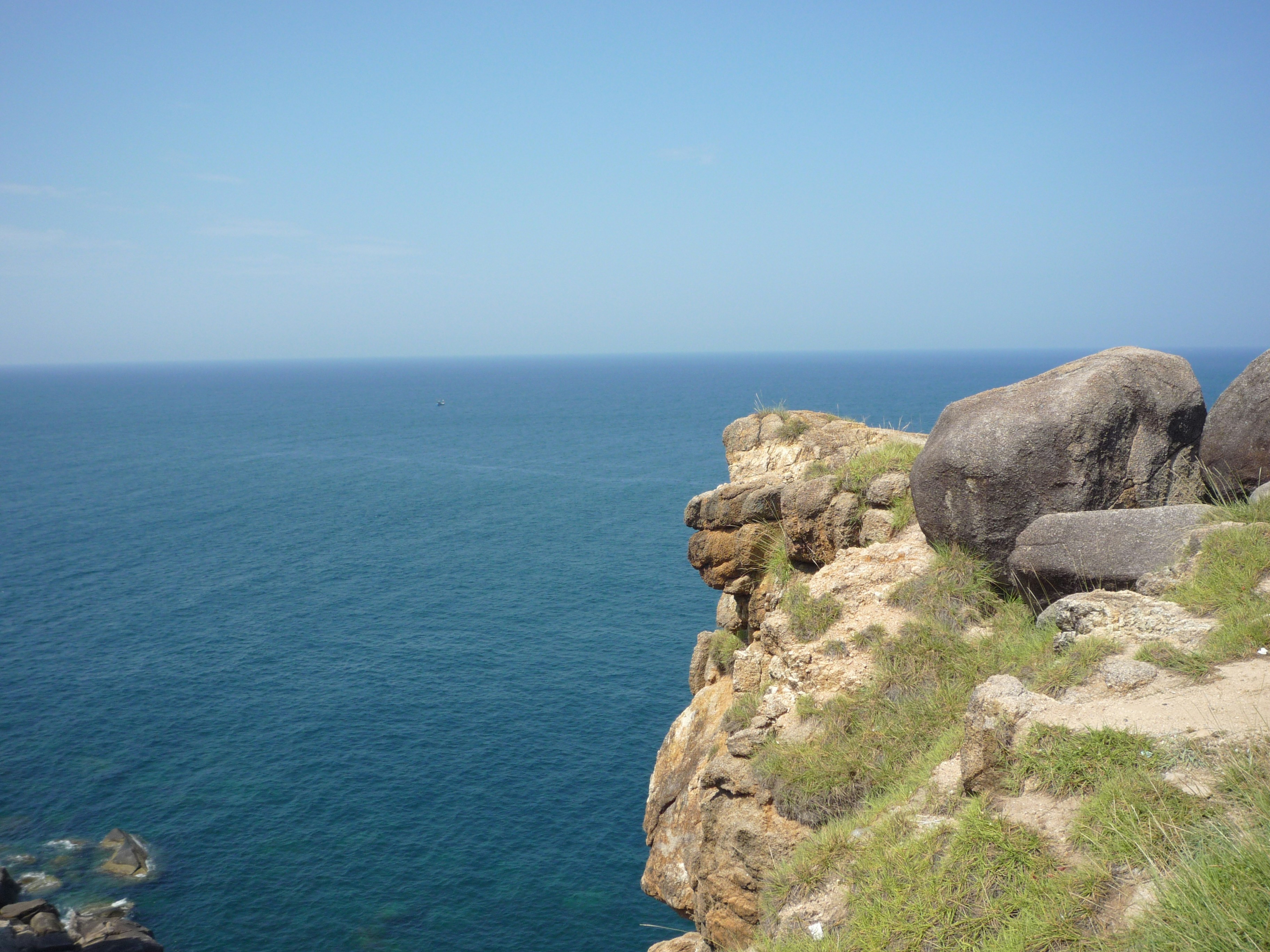 Cliff Edge Overlook as Ocean Glides into the Horizon