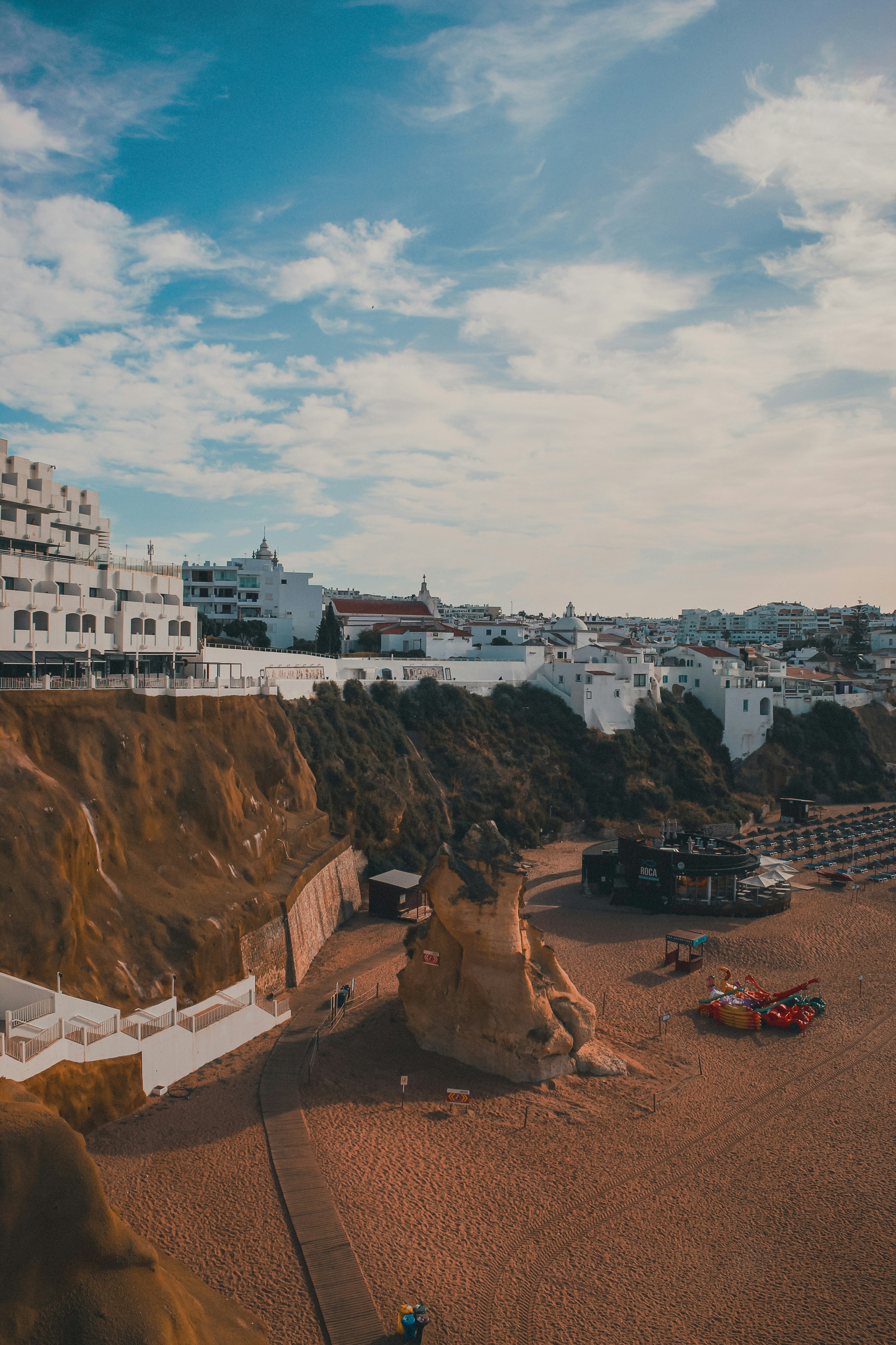 Cliffside Townscape Overlooking a Sunlit Beach