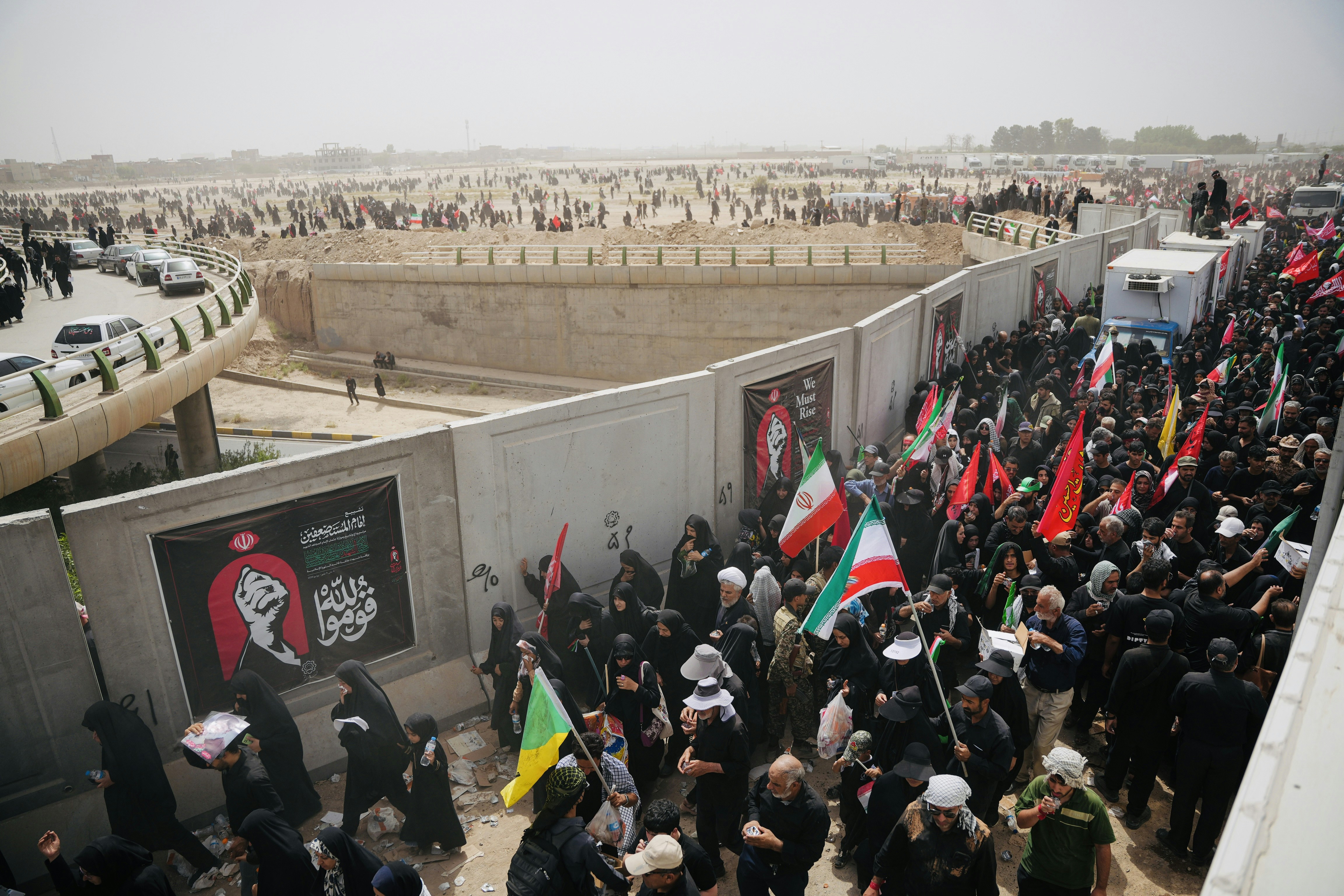 Flags in the Crowd: A Tense Corridor of Dissent Along the Barrier