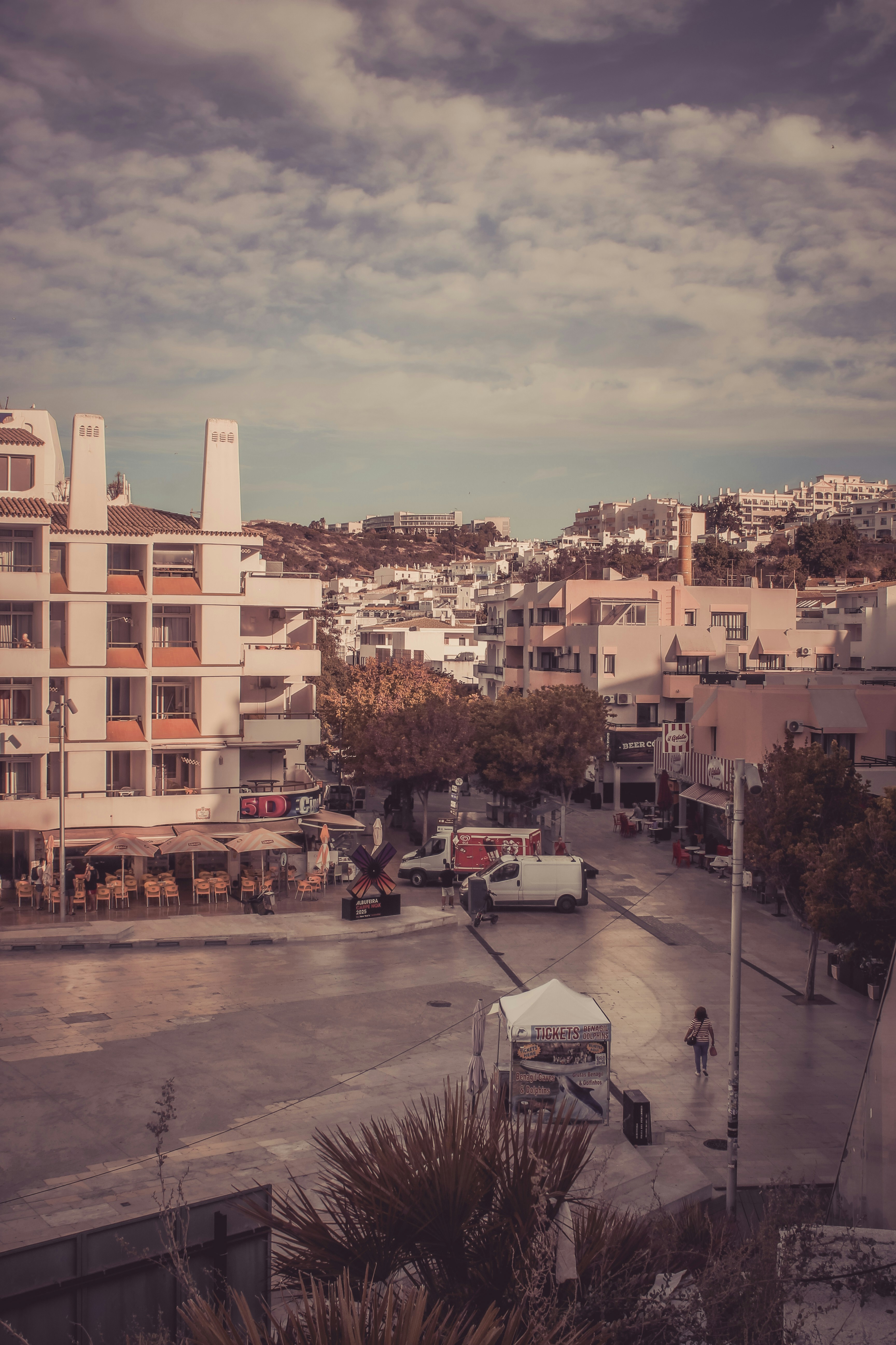 Sunlit Mediterranean Street Scene from a Windowed Perspective