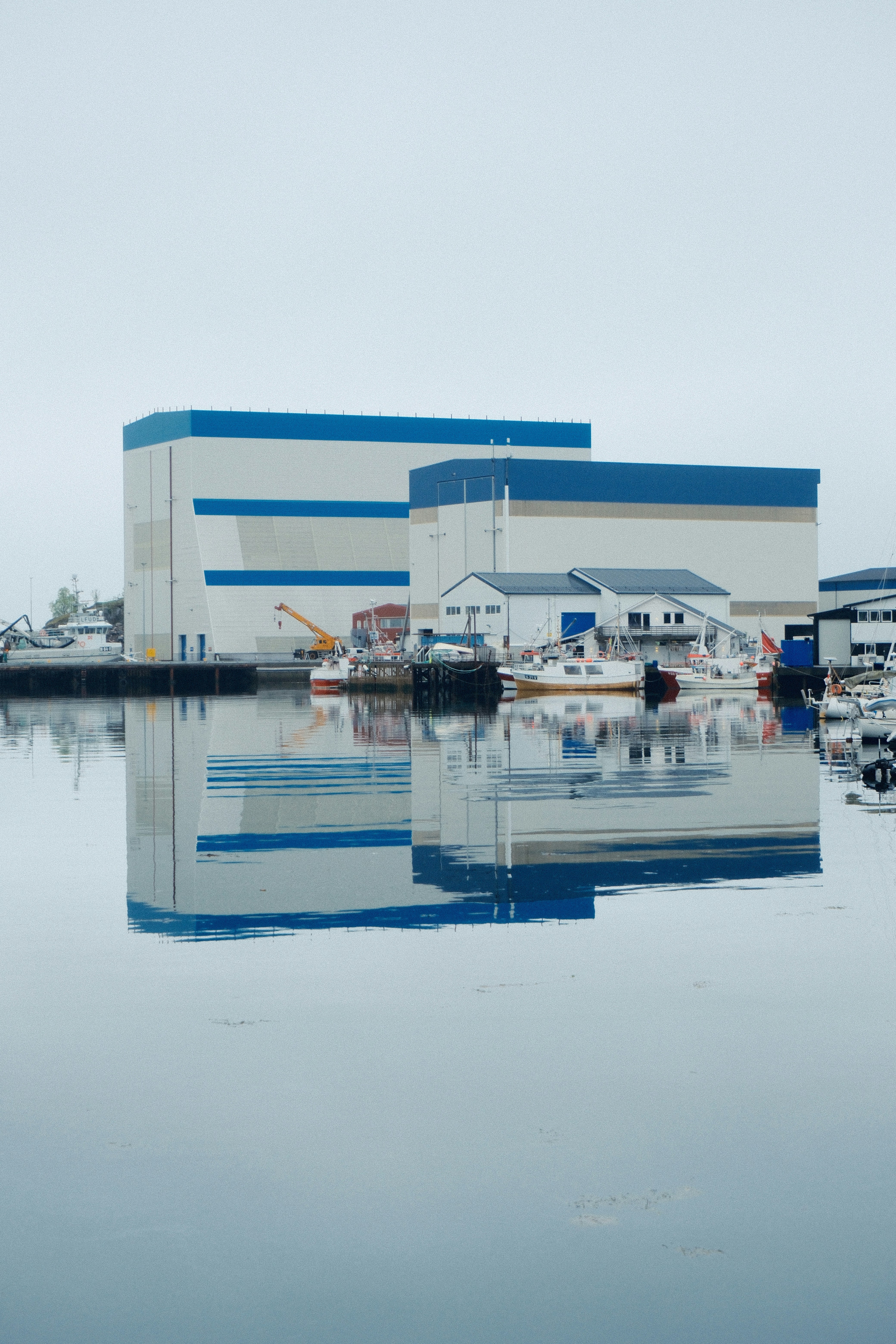 Coastal Yard: Reflections of a Blue-Trim Industrial Complex