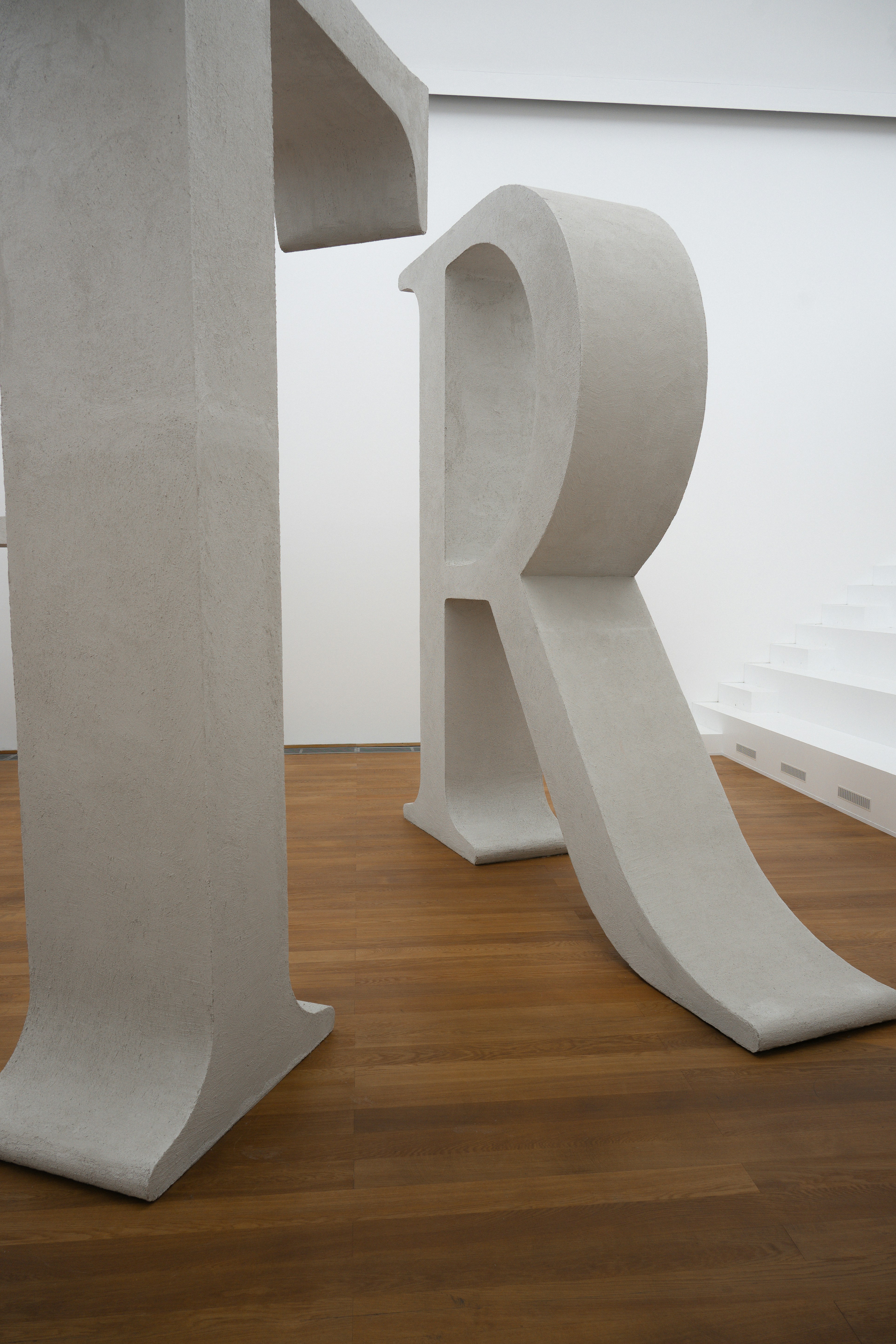 Monumental Curves: A Slender R Letter Edition in White