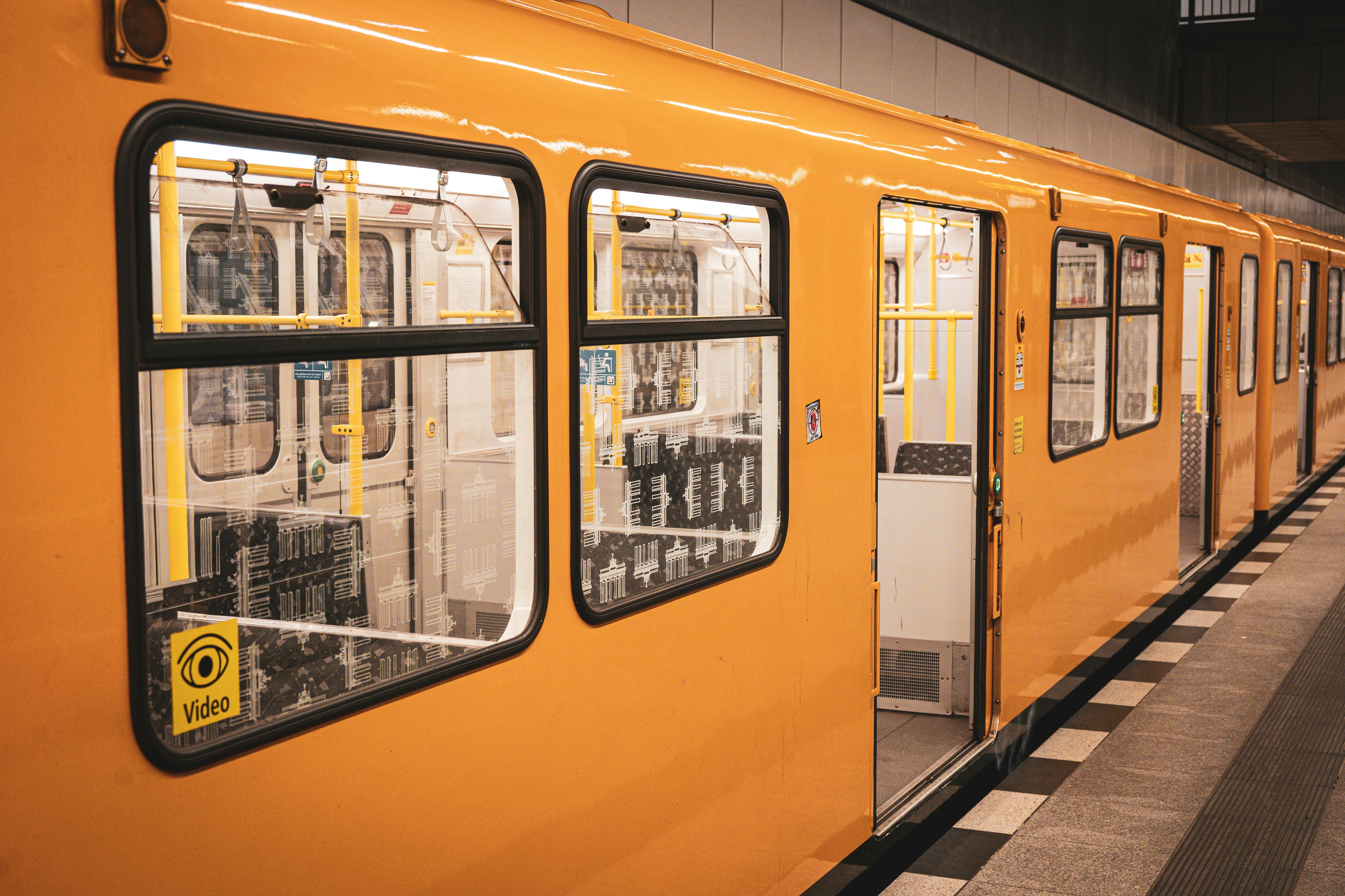 Orange Commuter: A Quiet Moment on the Platform