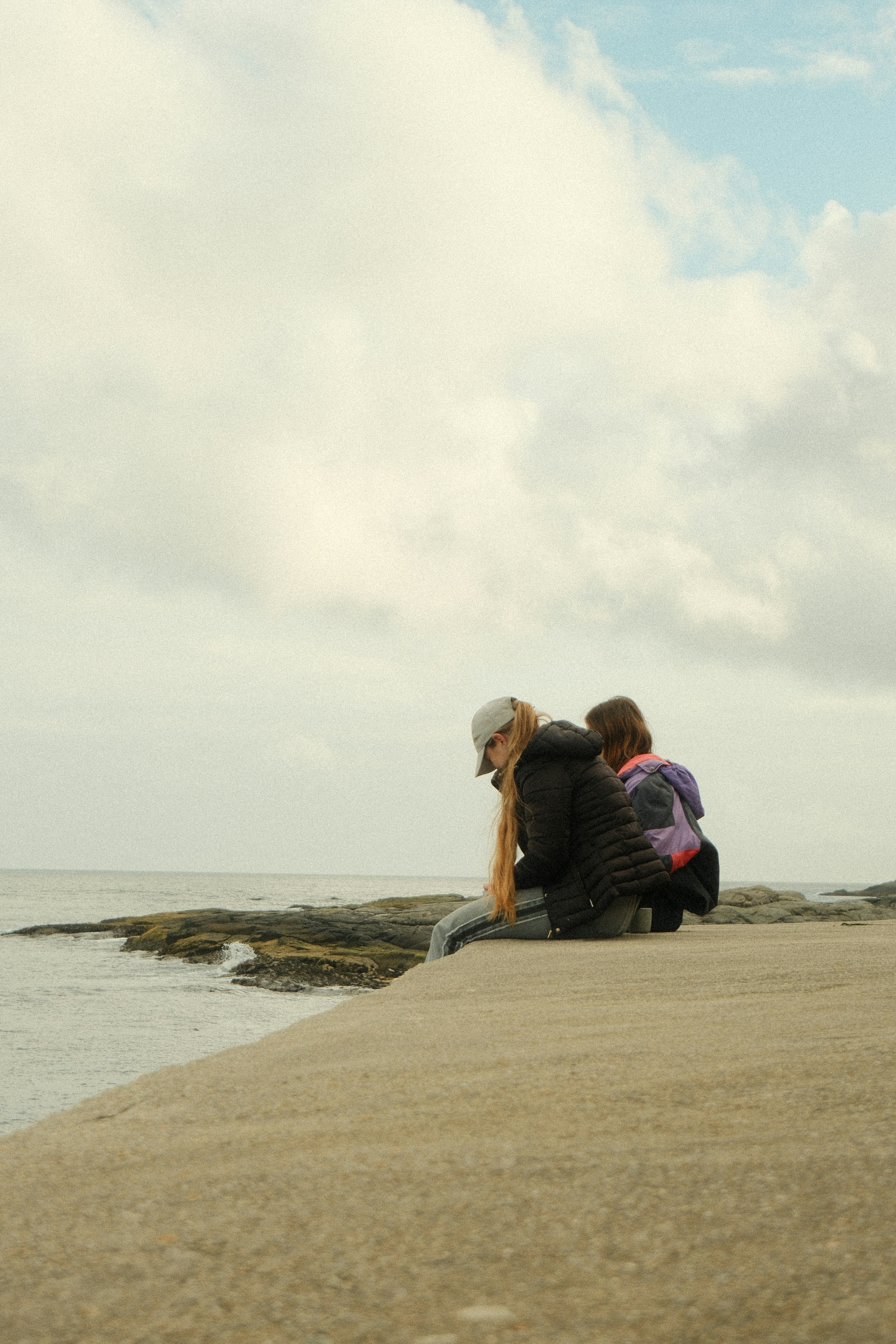 Two Friends on the Shoreline: Quiet Conversation at Distant Edge