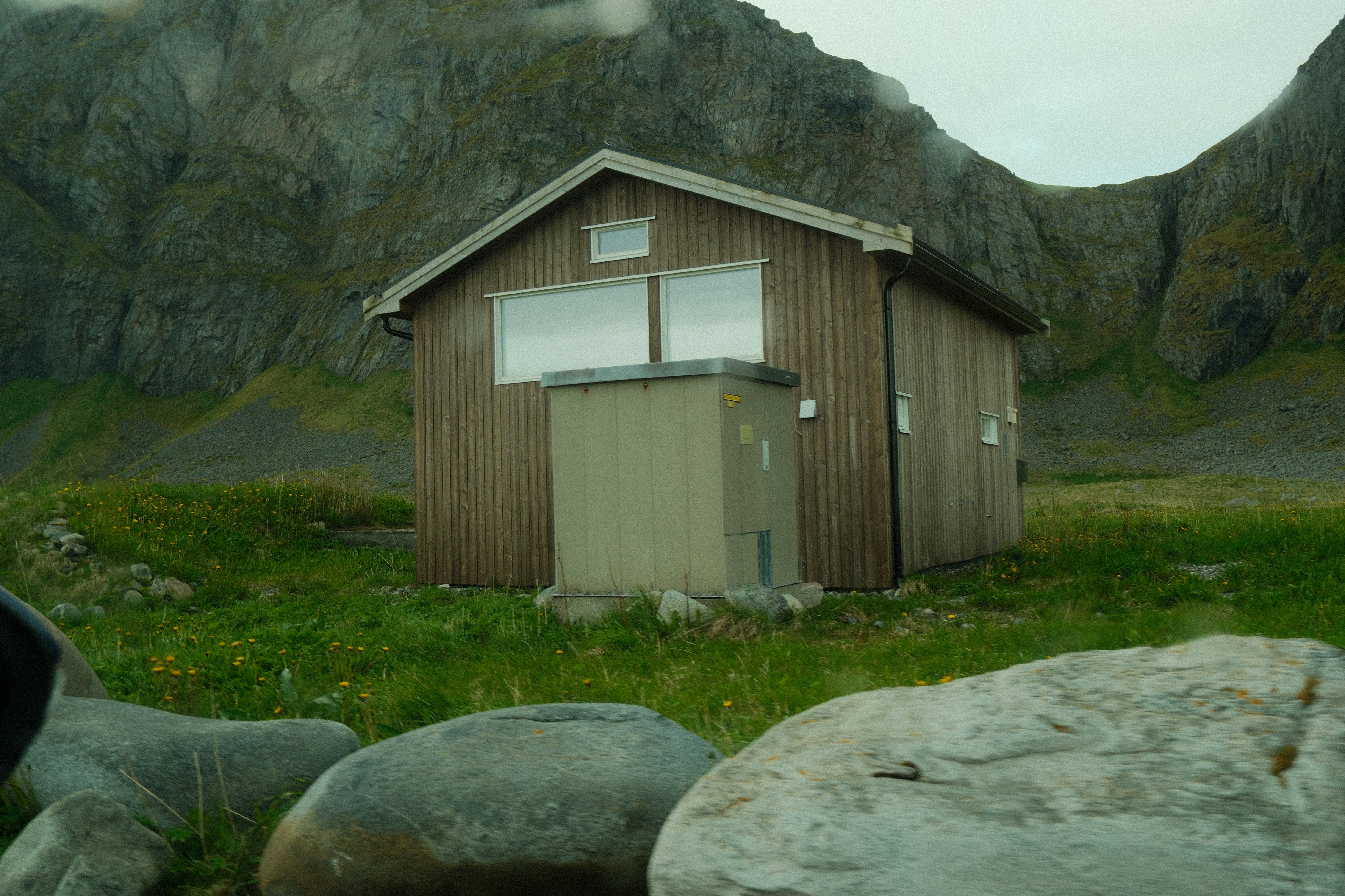 Harboring Quiet: A Mountain Farm Shed Nestled Among Stones