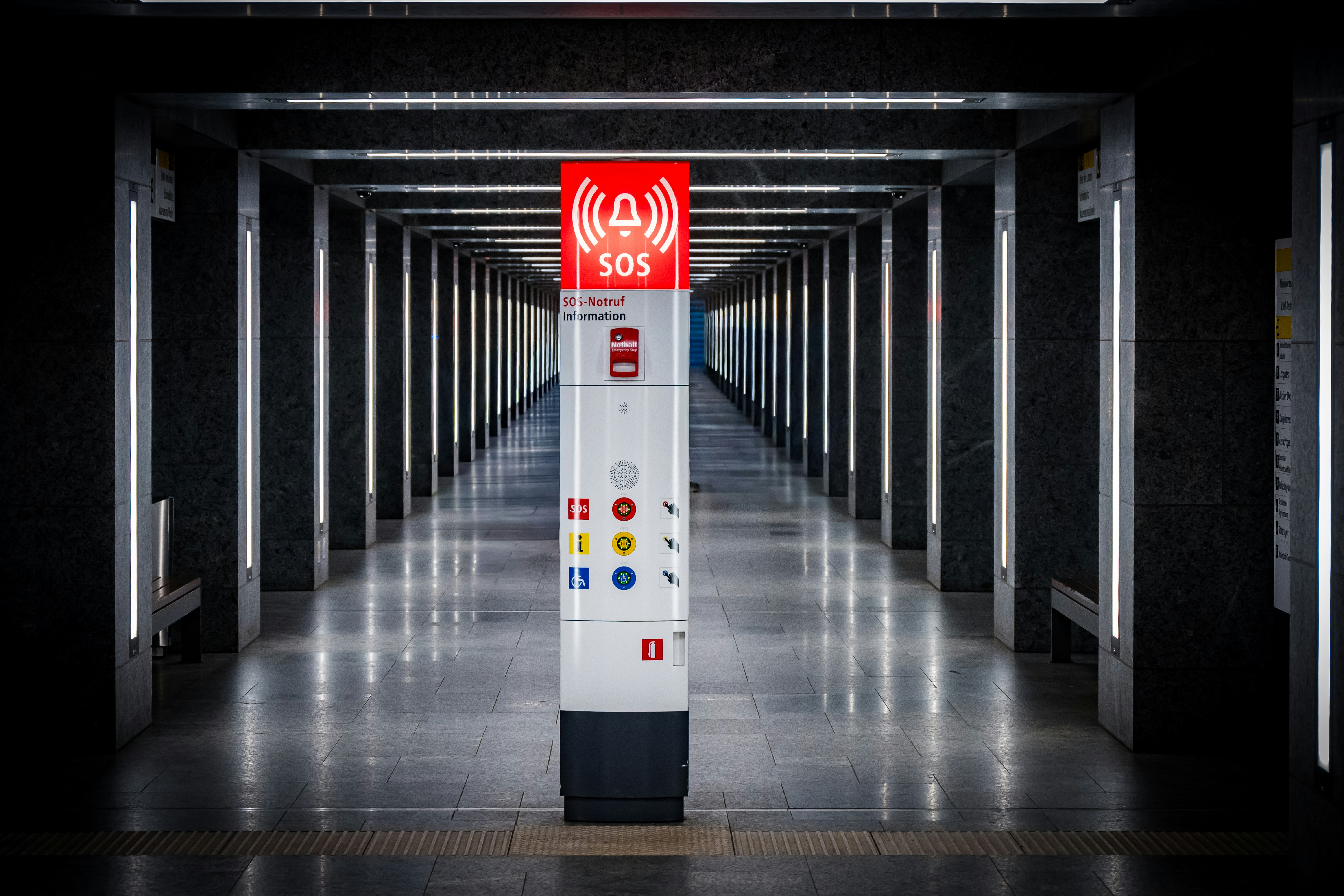 Isolated Emergency Call Stand in a Symmetric Subway Hall