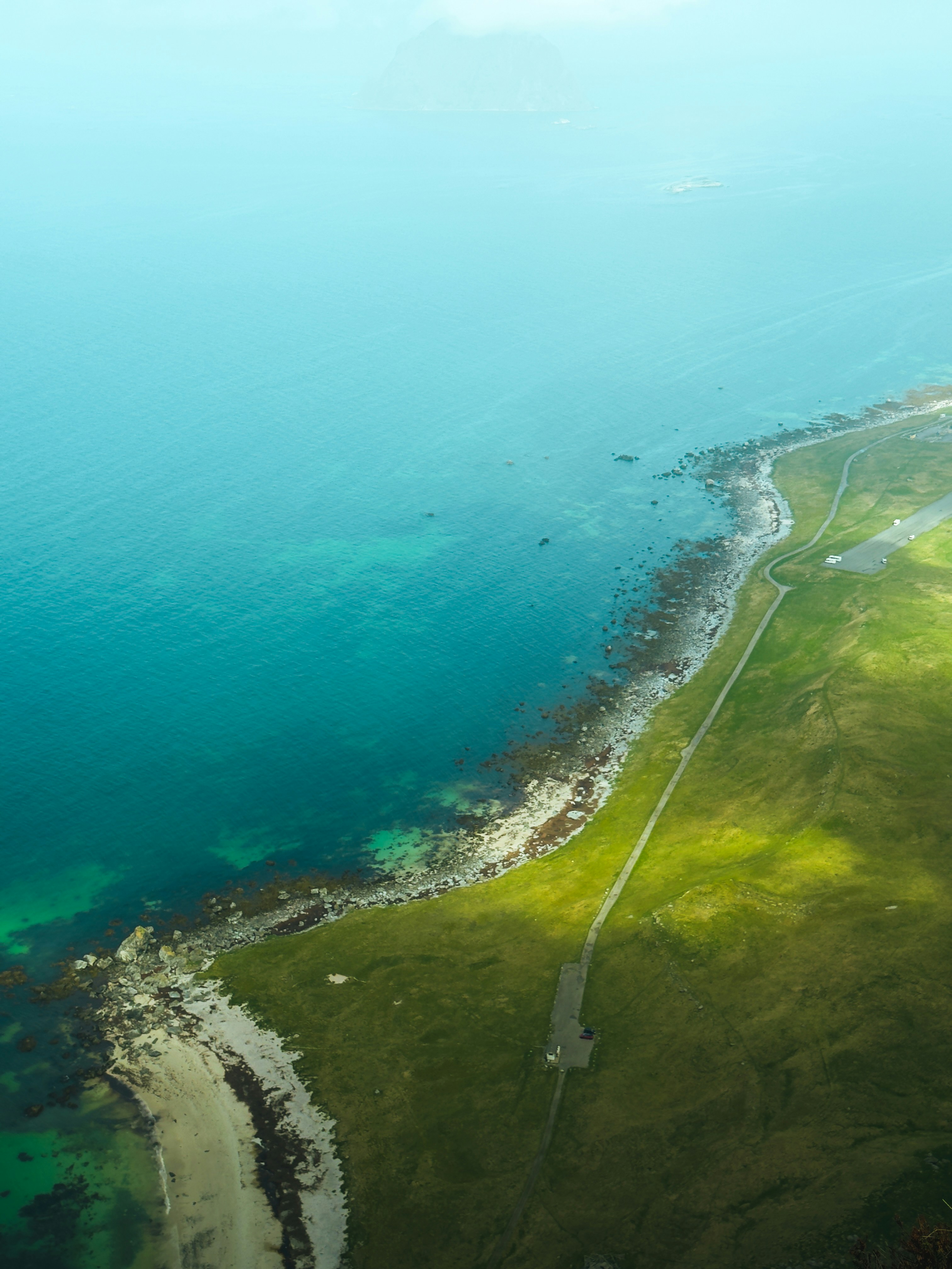 Coastal ribbon: a windswept peninsula dropping into turquoise waters