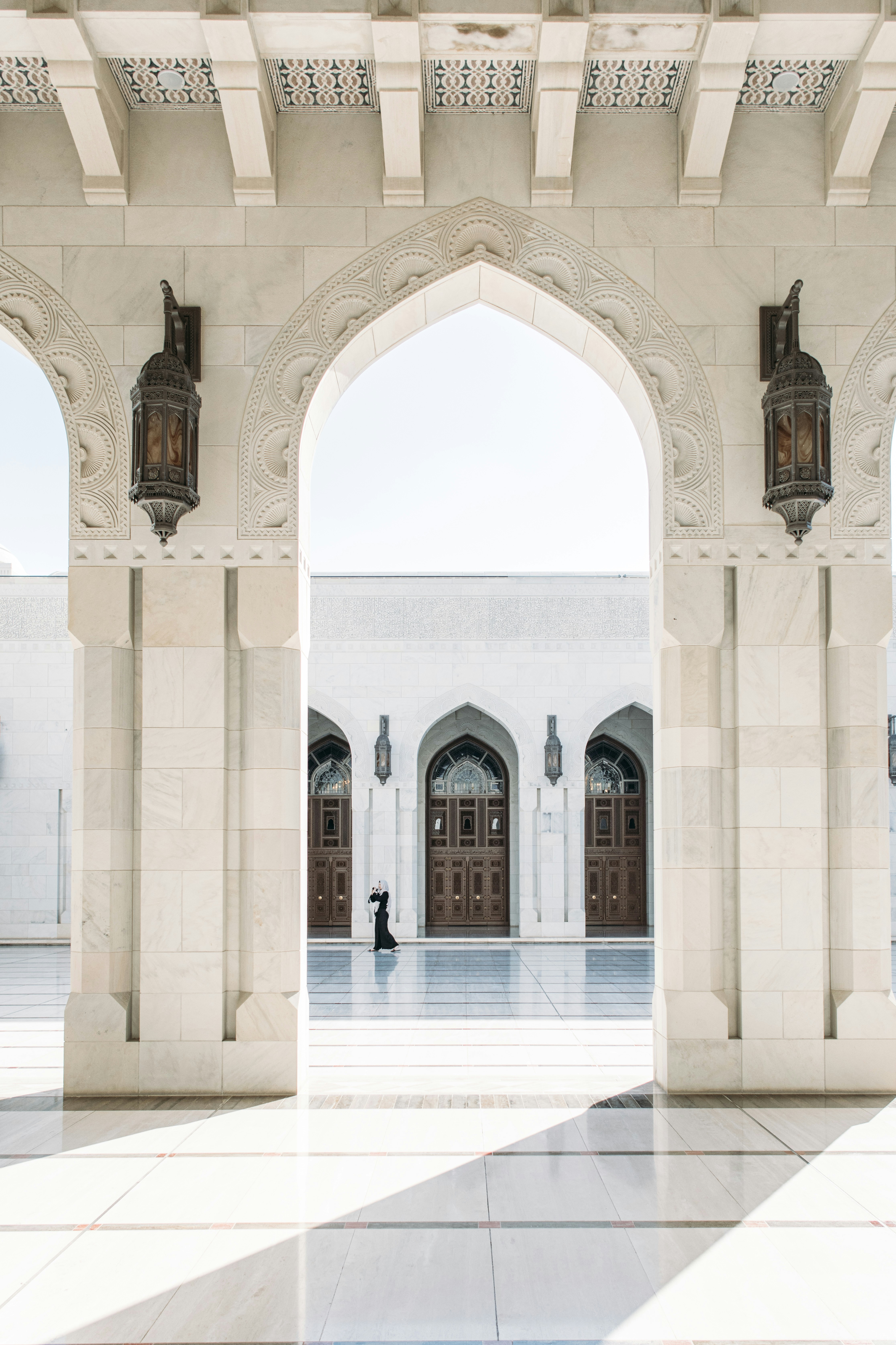 Archway of Light: A Couple in a Corridor of Marble