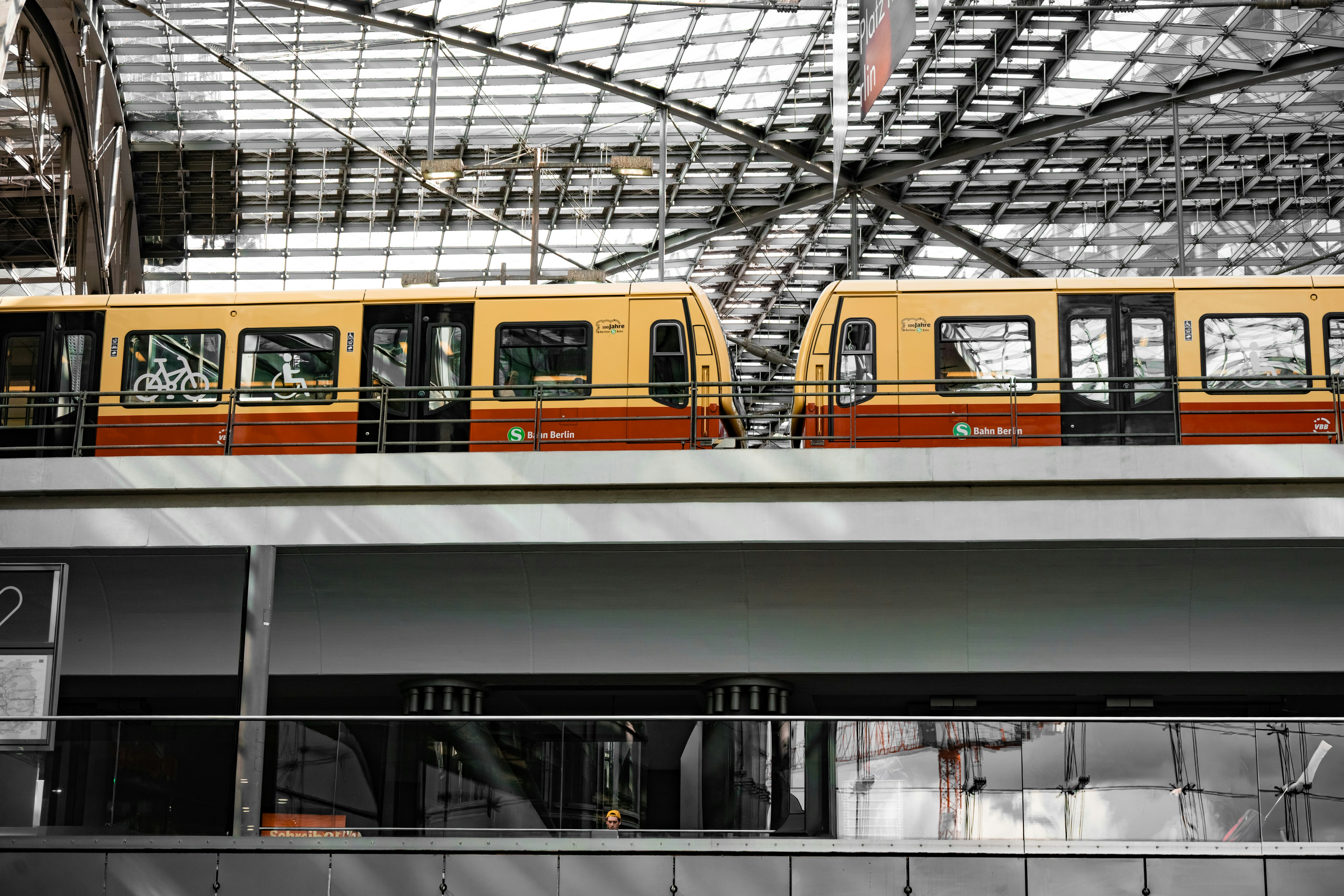 Mid-Platform Orange: A Quiet Moment Between Trains