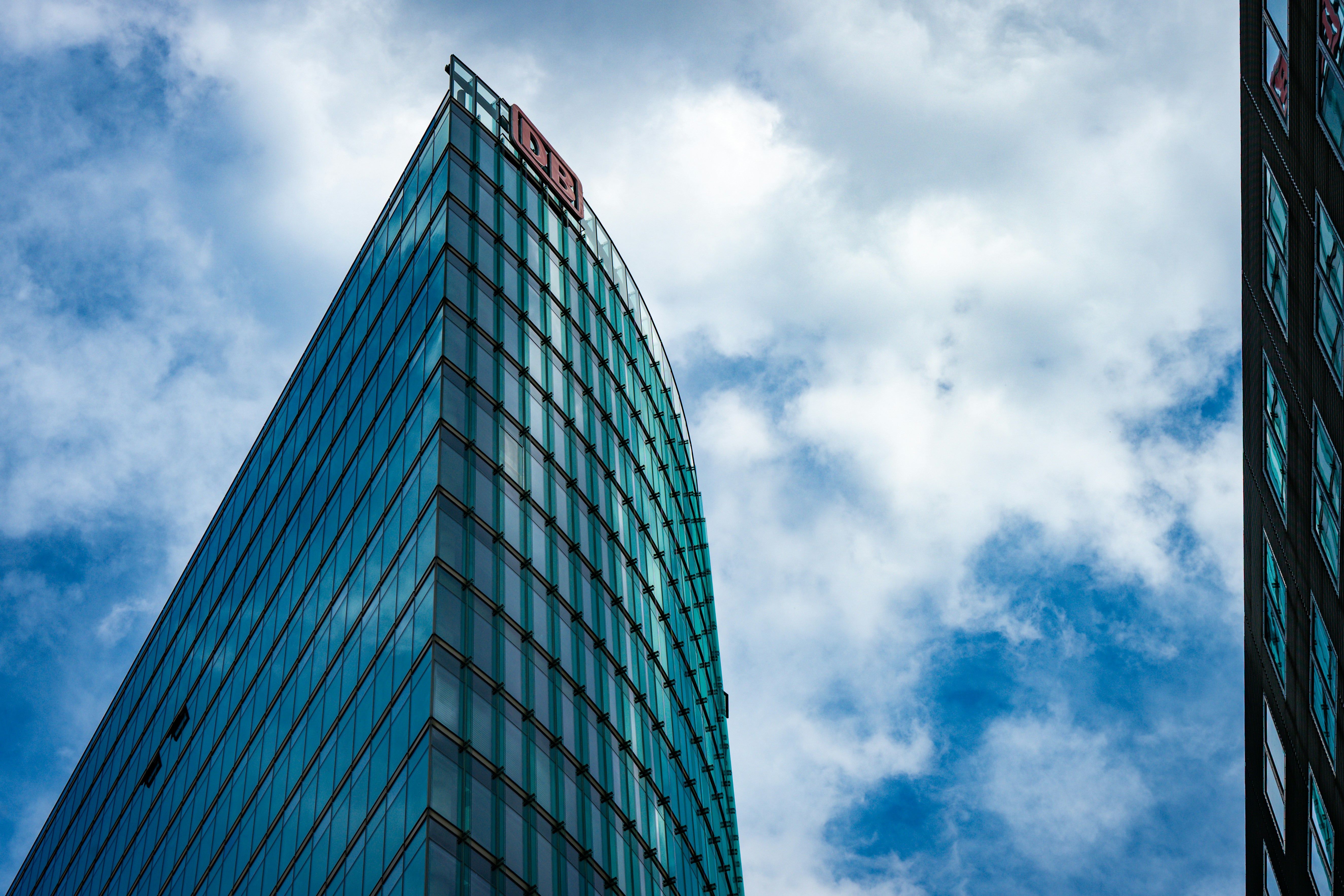 Skyward Facade: A Glass-Chelled Tower Reaching the Blue