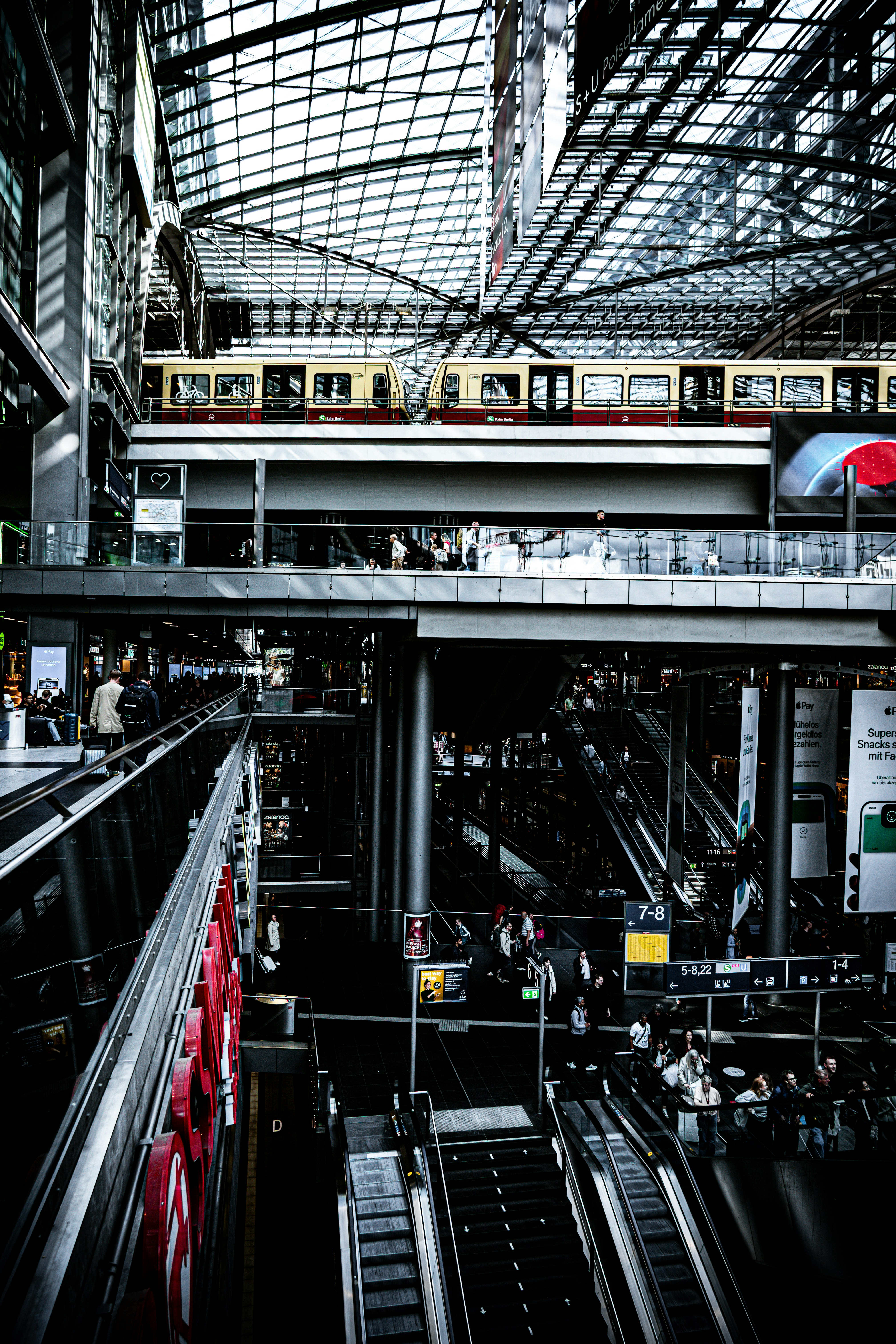 Transit Cathedral: A Grand Urban Atrium with Moving Trains