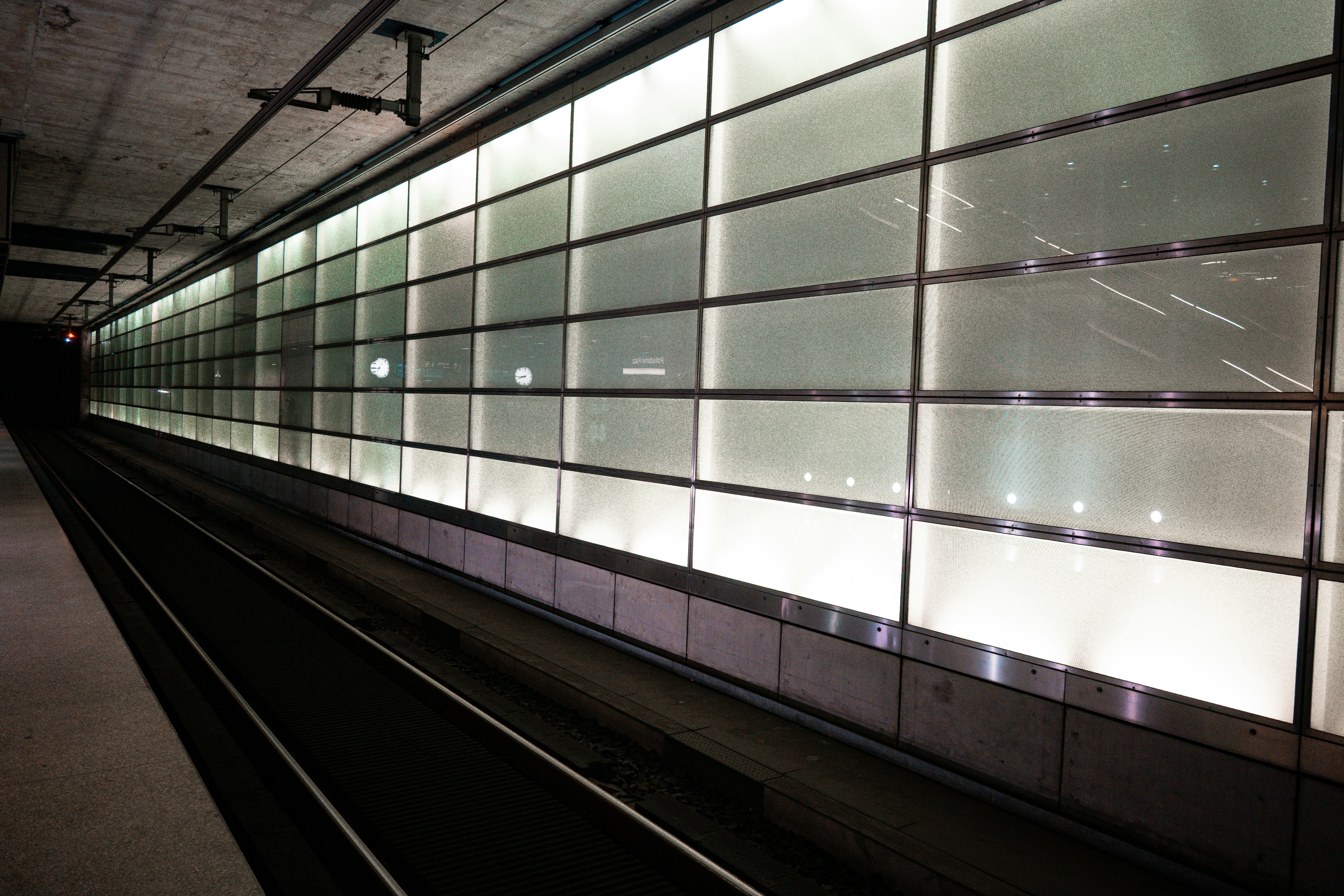 Glow of the Tunnel: A Quiet Subway Platform in Cross-Hatch Light
