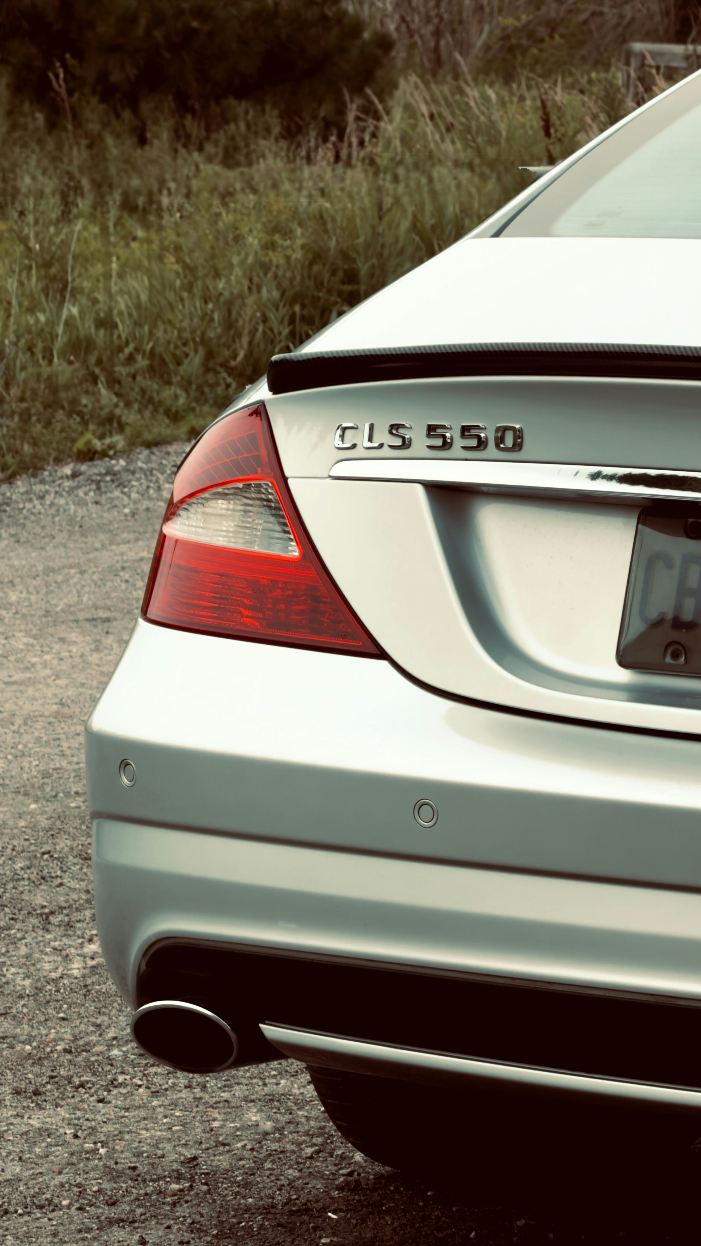 Rear Badge Reflection: A CLS 550 Quietly Framed