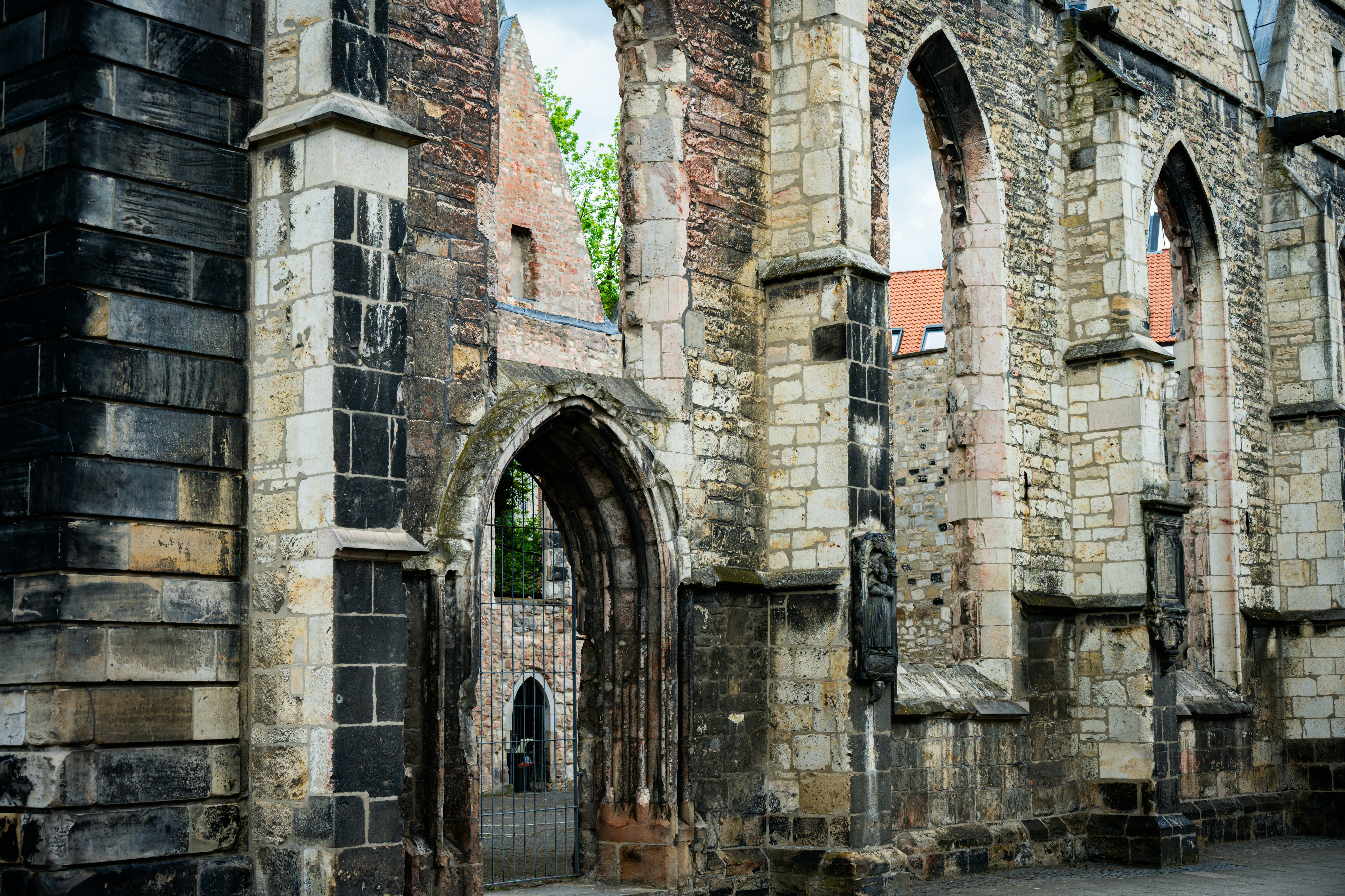 Gateway Through Time: An Ancient Abbey Ruin Framed by Arched Wall Remnants