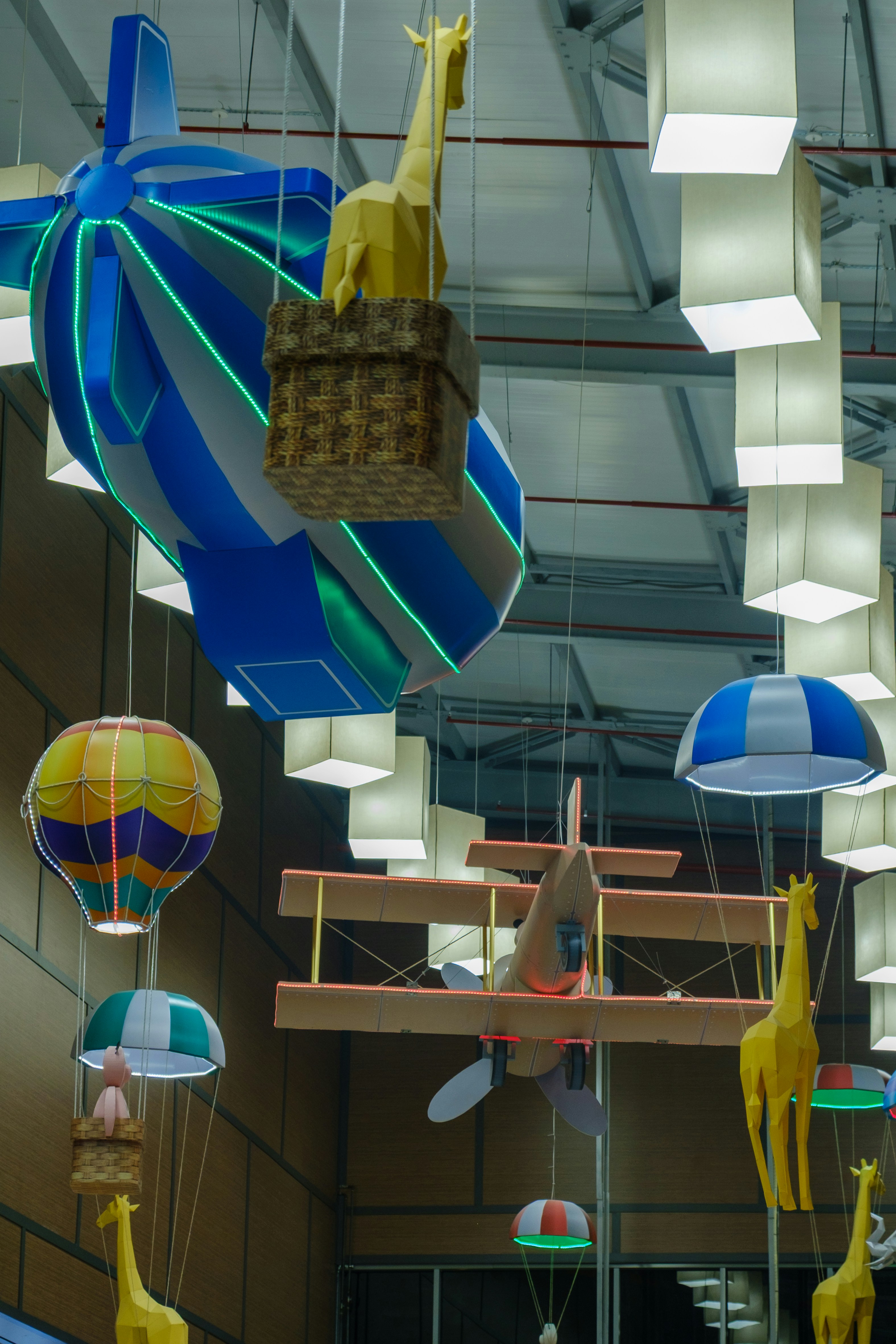 Floating Playgrounds: Colorful Airborne Toys in a Modern Interior