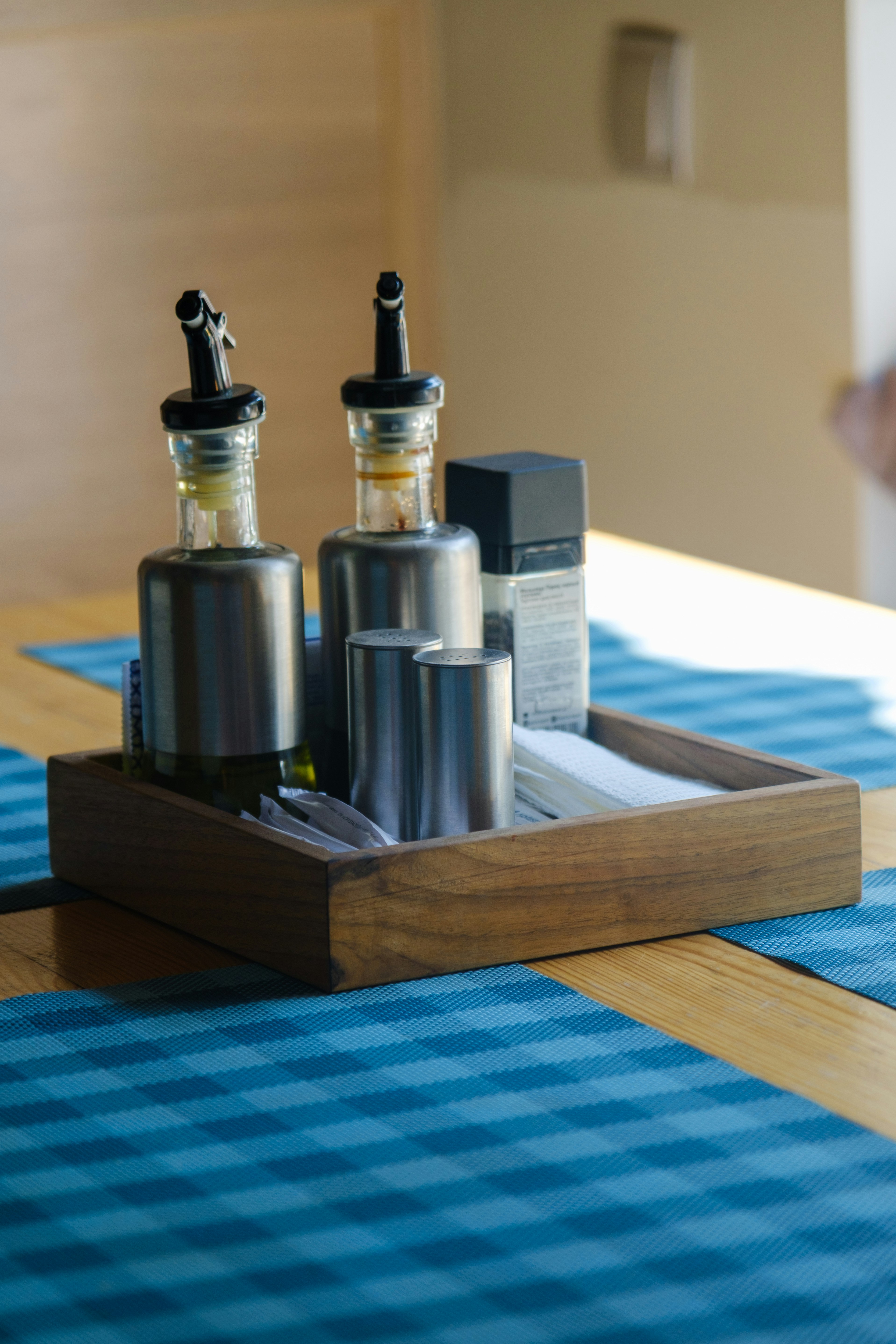 Bottled Condiments on a Wooden Tray: Calm Kitchen Still Life